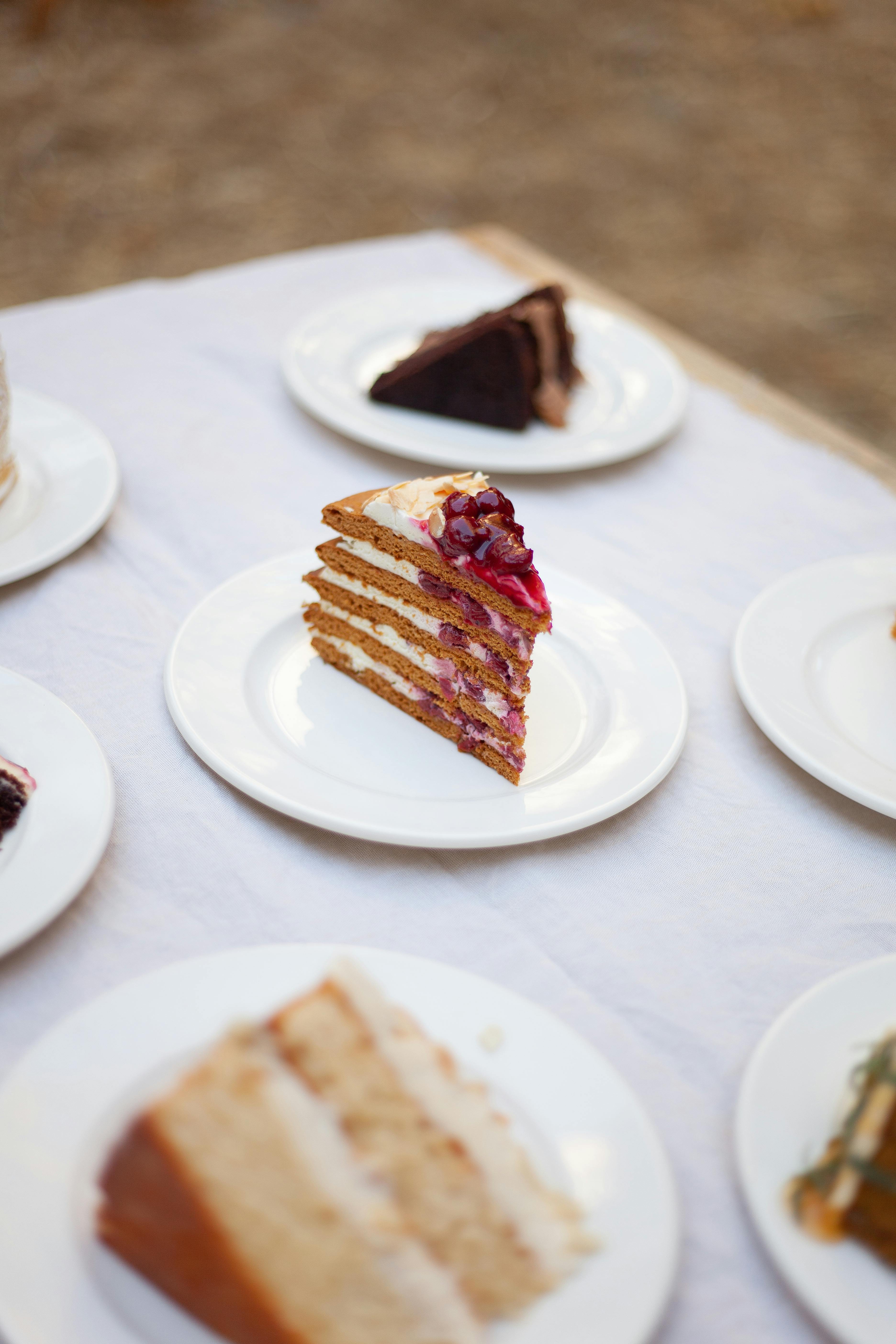Plates with Different Slices of Cakes · Free Stock Photo