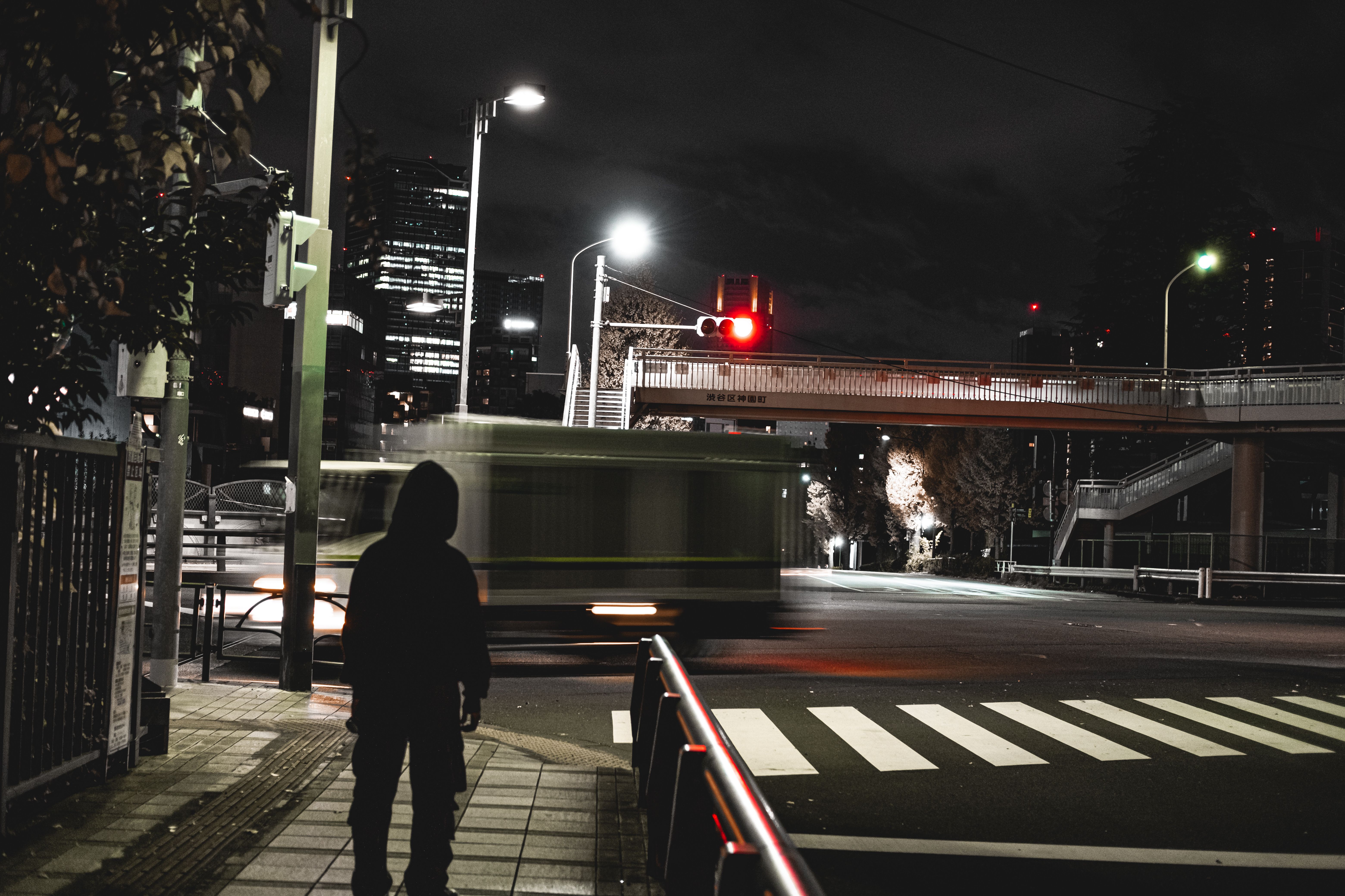 Person Walking on Street in Night City · Free Stock Photo