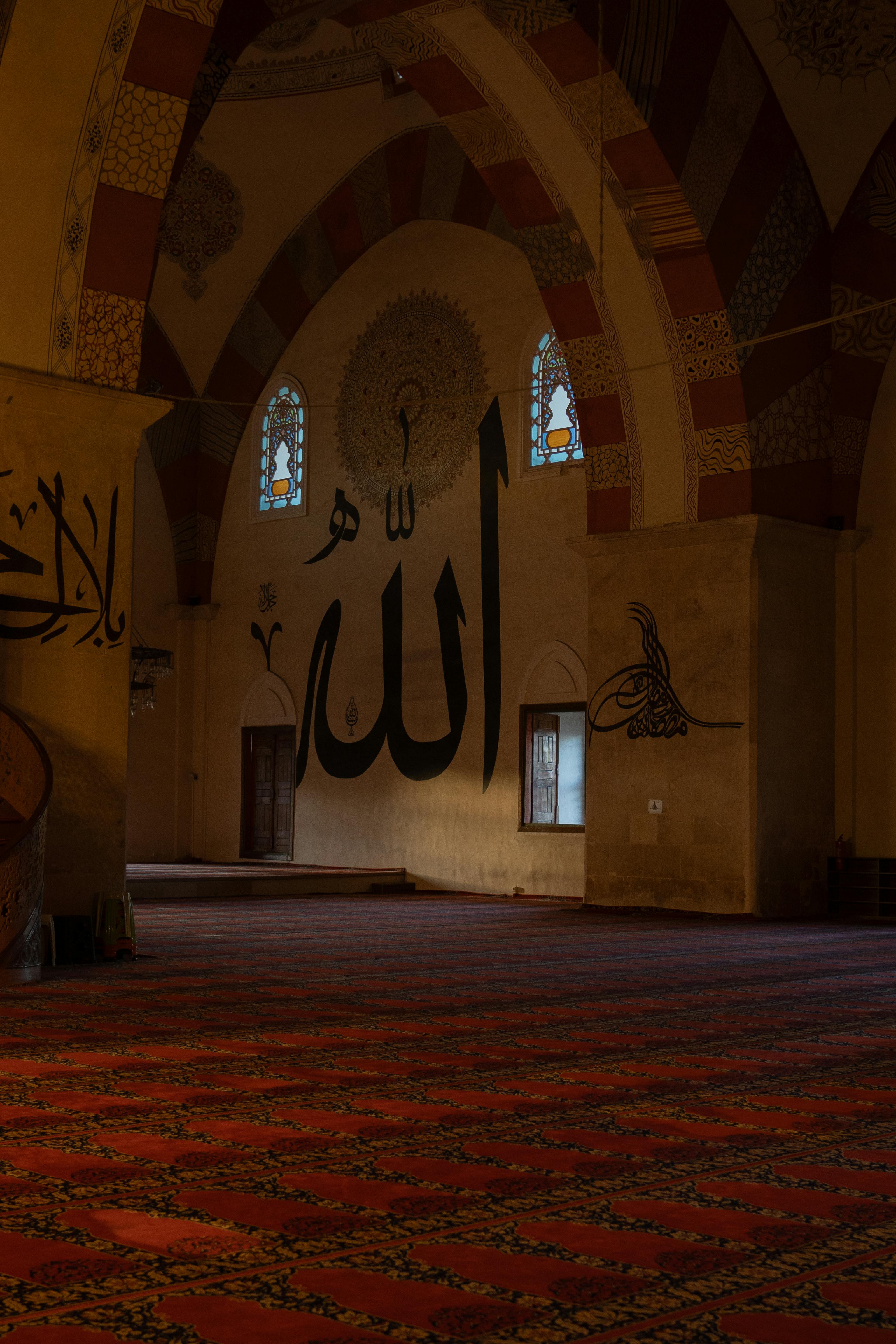 Mosque Interior with Symbol on Walls · Free Stock Photo