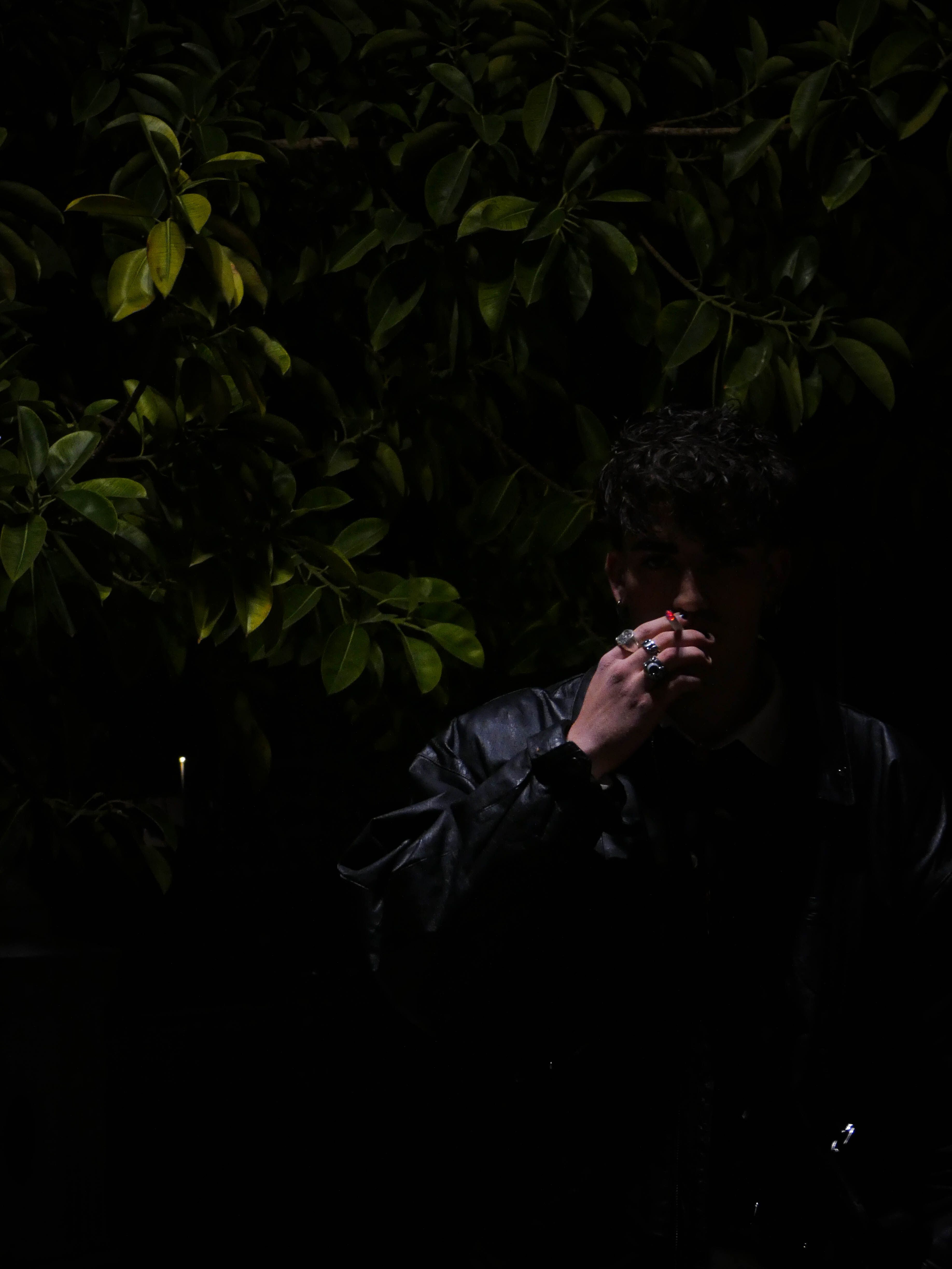 Handsome Man Smoking Cigarette in Dark · Free Stock Photo