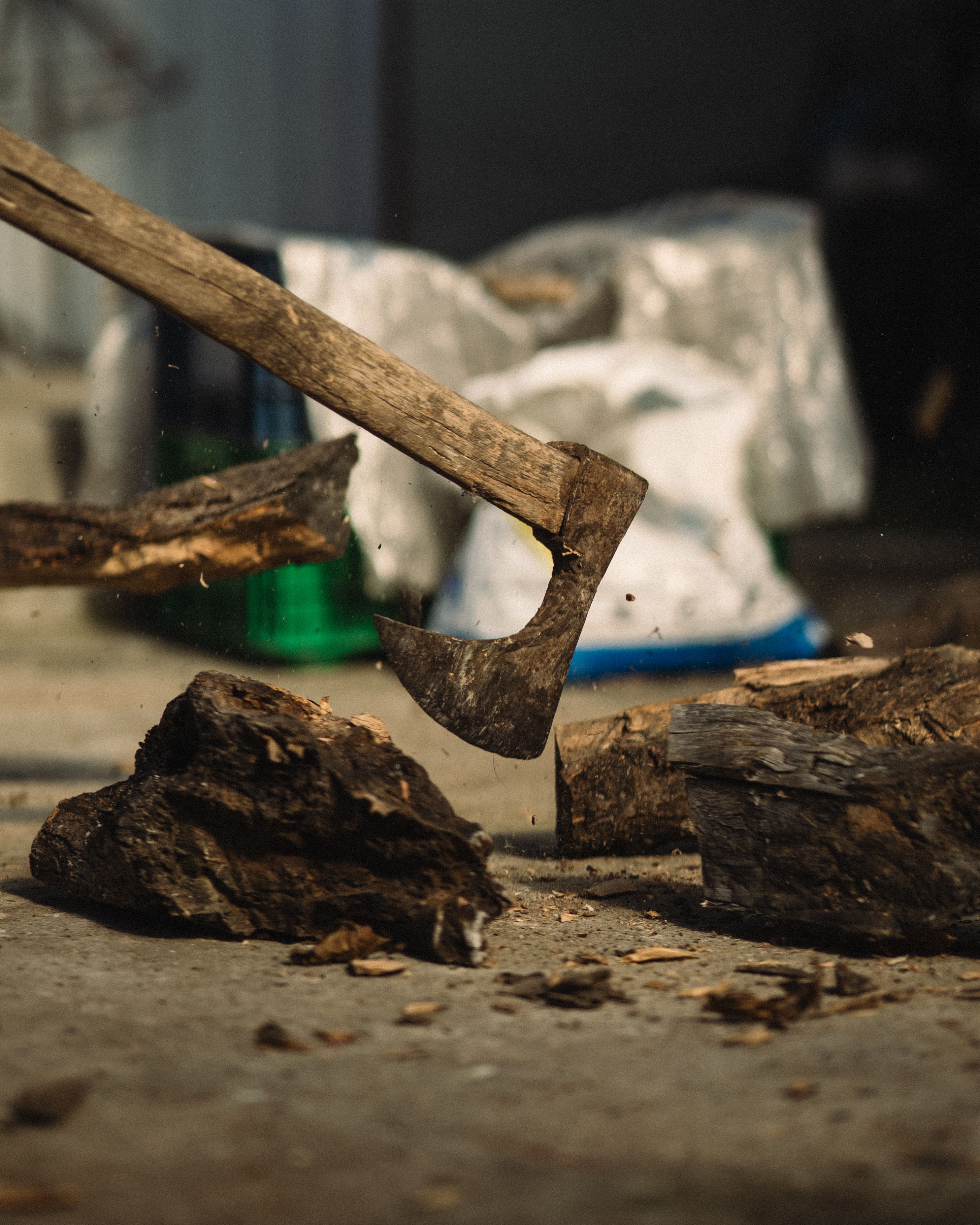 Person Smashing Pick Axe On Ground · Free Stock Photo