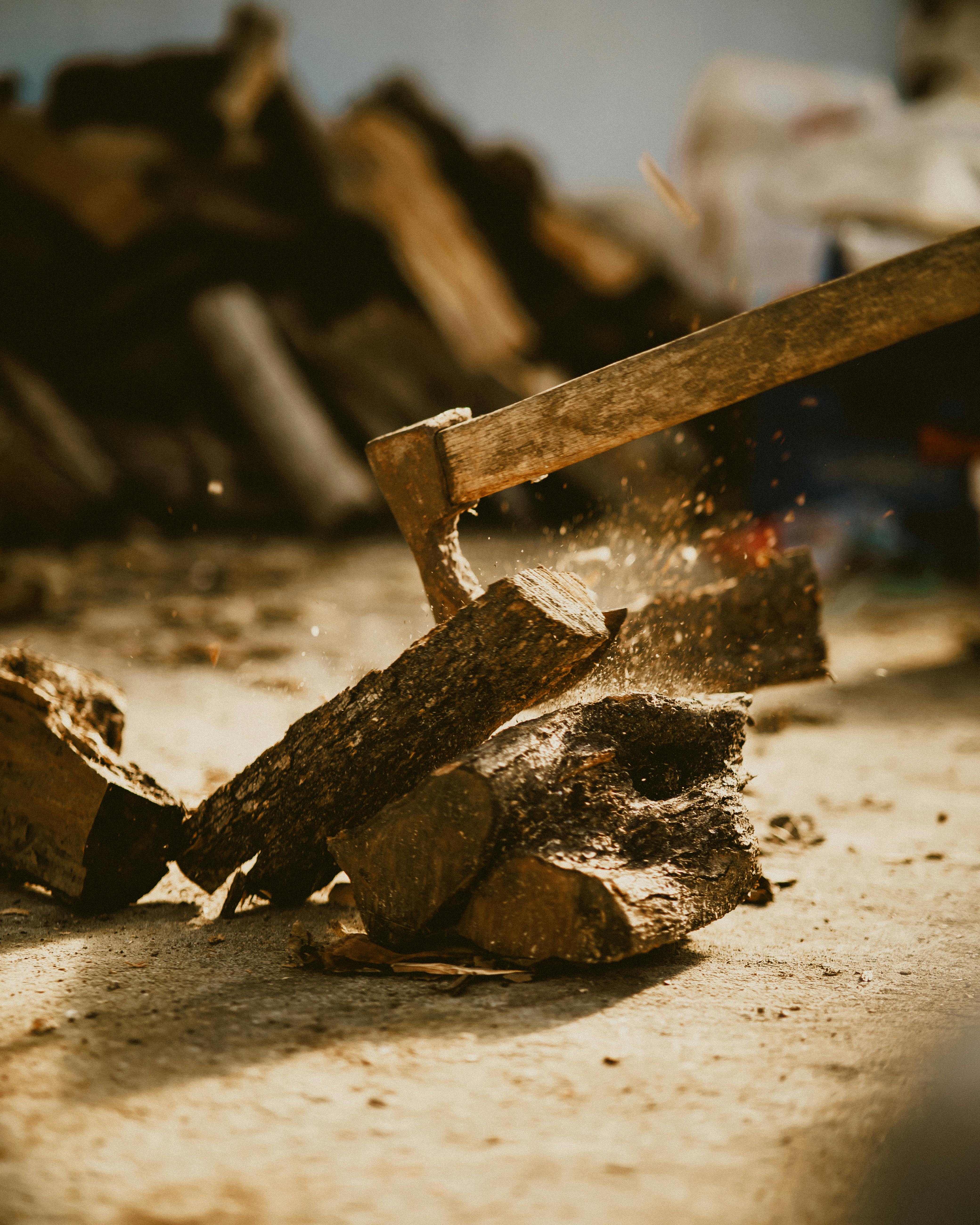 Person Smashing Pick Axe On Ground · Free Stock Photo