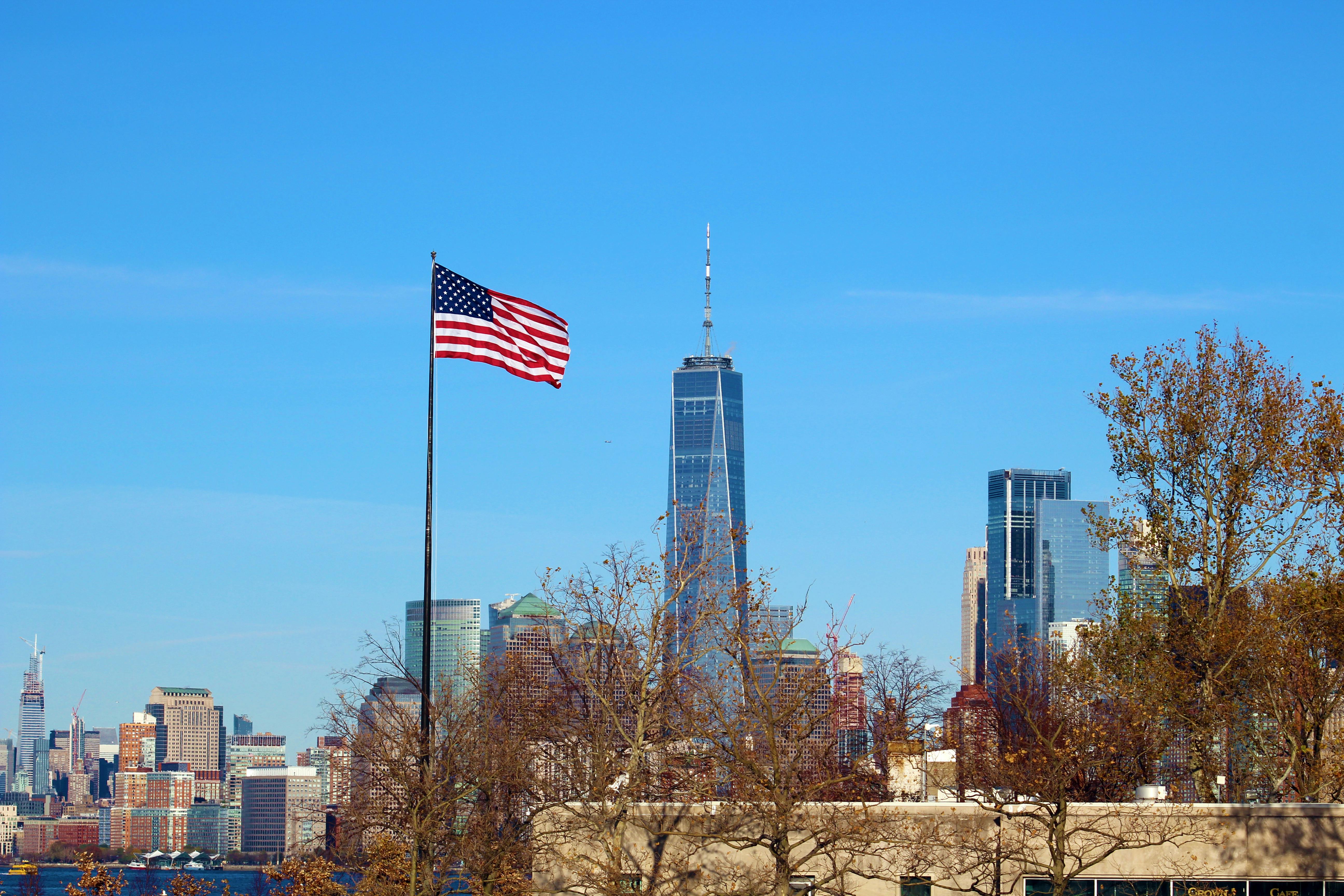 Flagpole with an American Flag with the One World Trade Centre in the ...