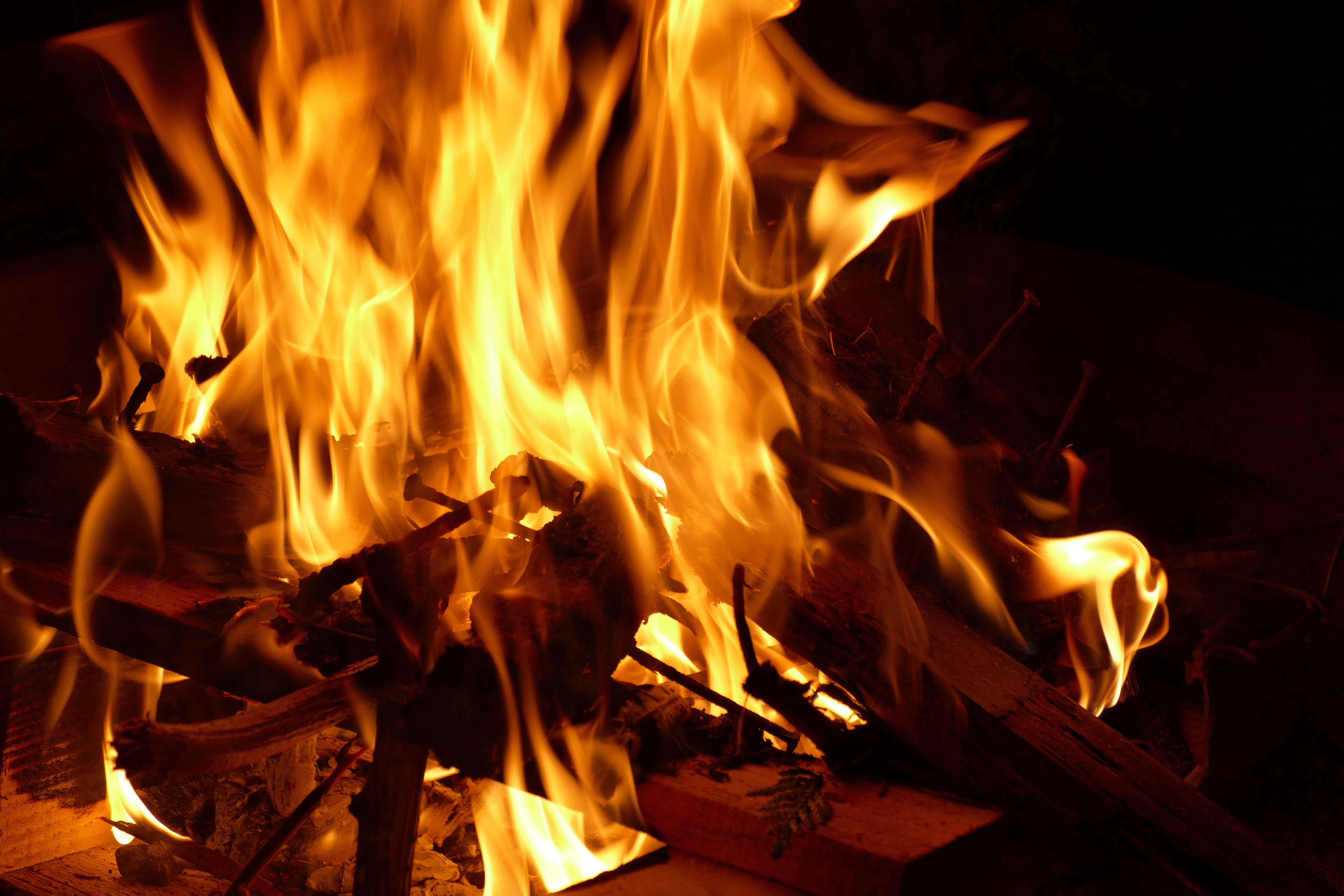 Old Man Burning Campfire in Wasteland · Free Stock Photo