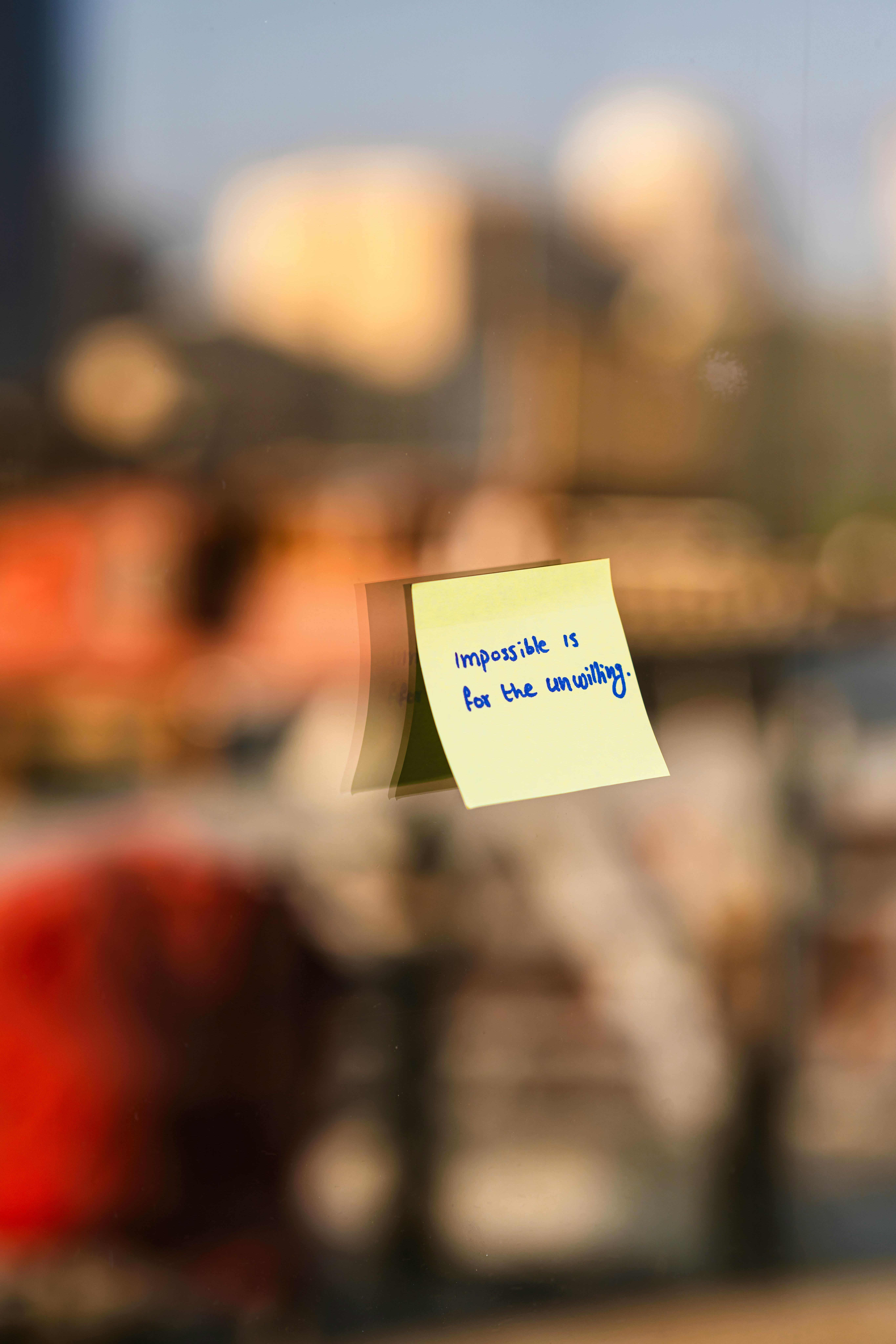 Sticky Note on a Glass Wall · Free Stock Photo