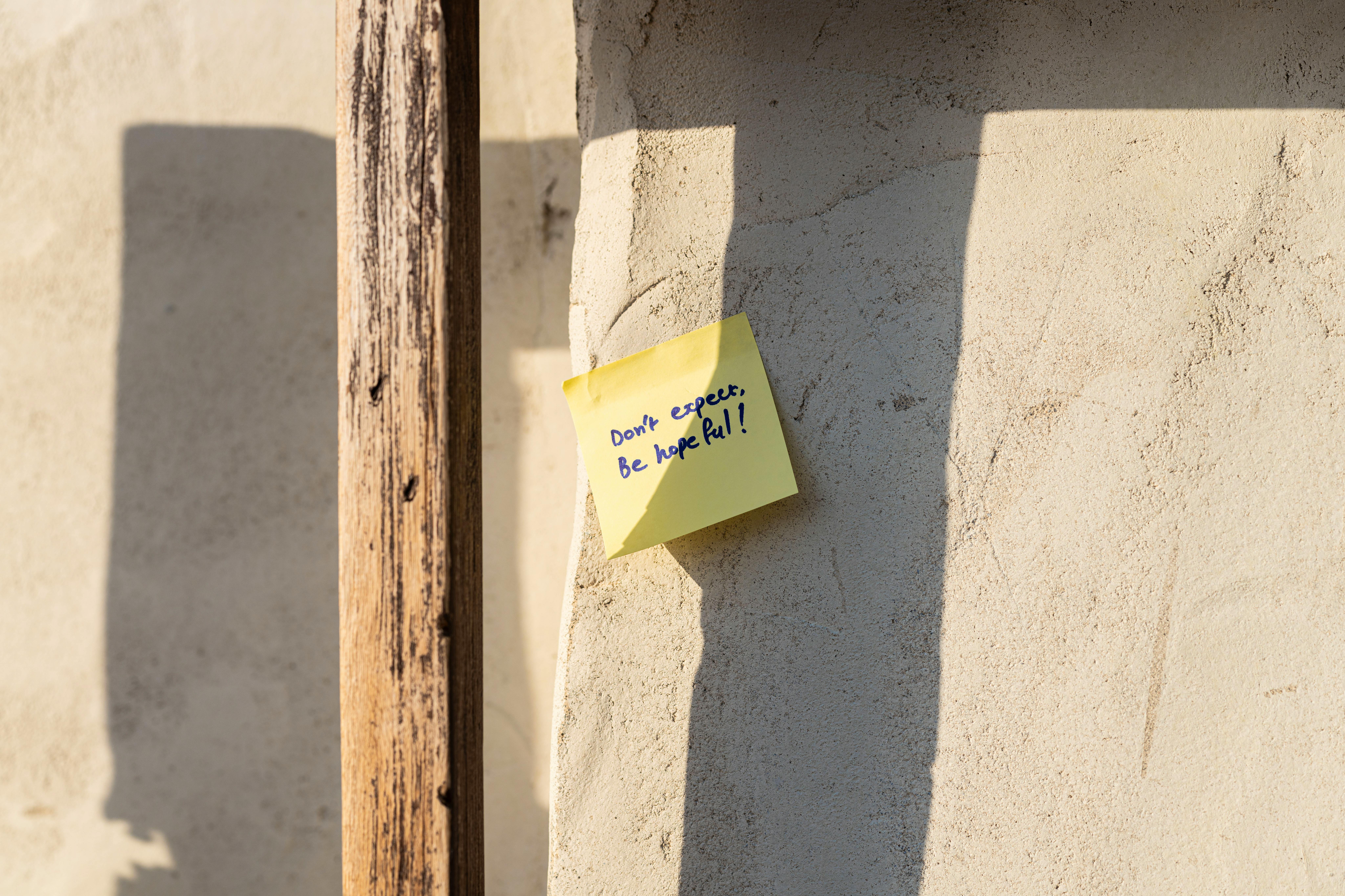 Sticky Note on a Wall in Sunlight · Free Stock Photo