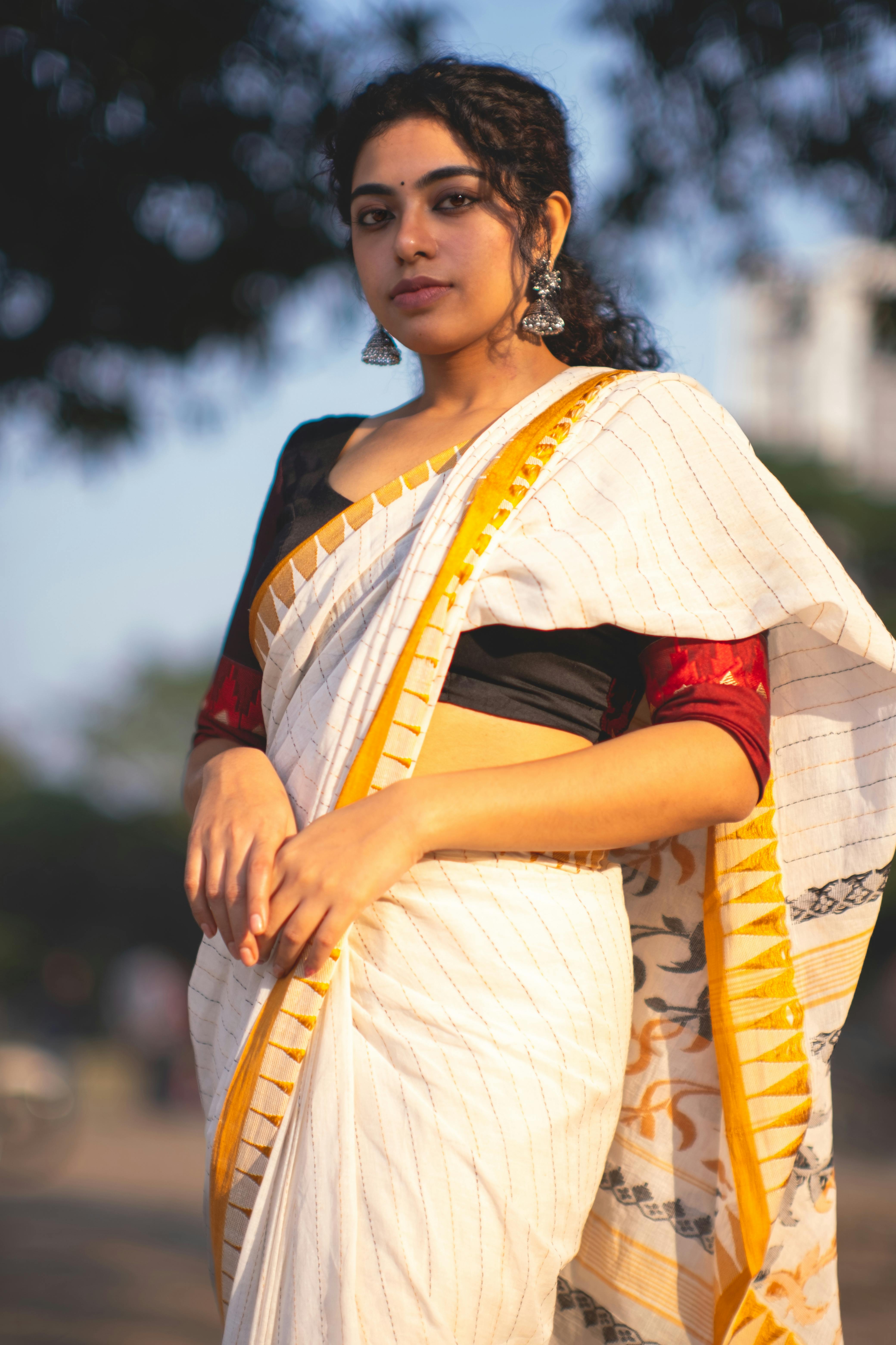 Woman in a Traditional Dress Modeling · Free Stock Photo