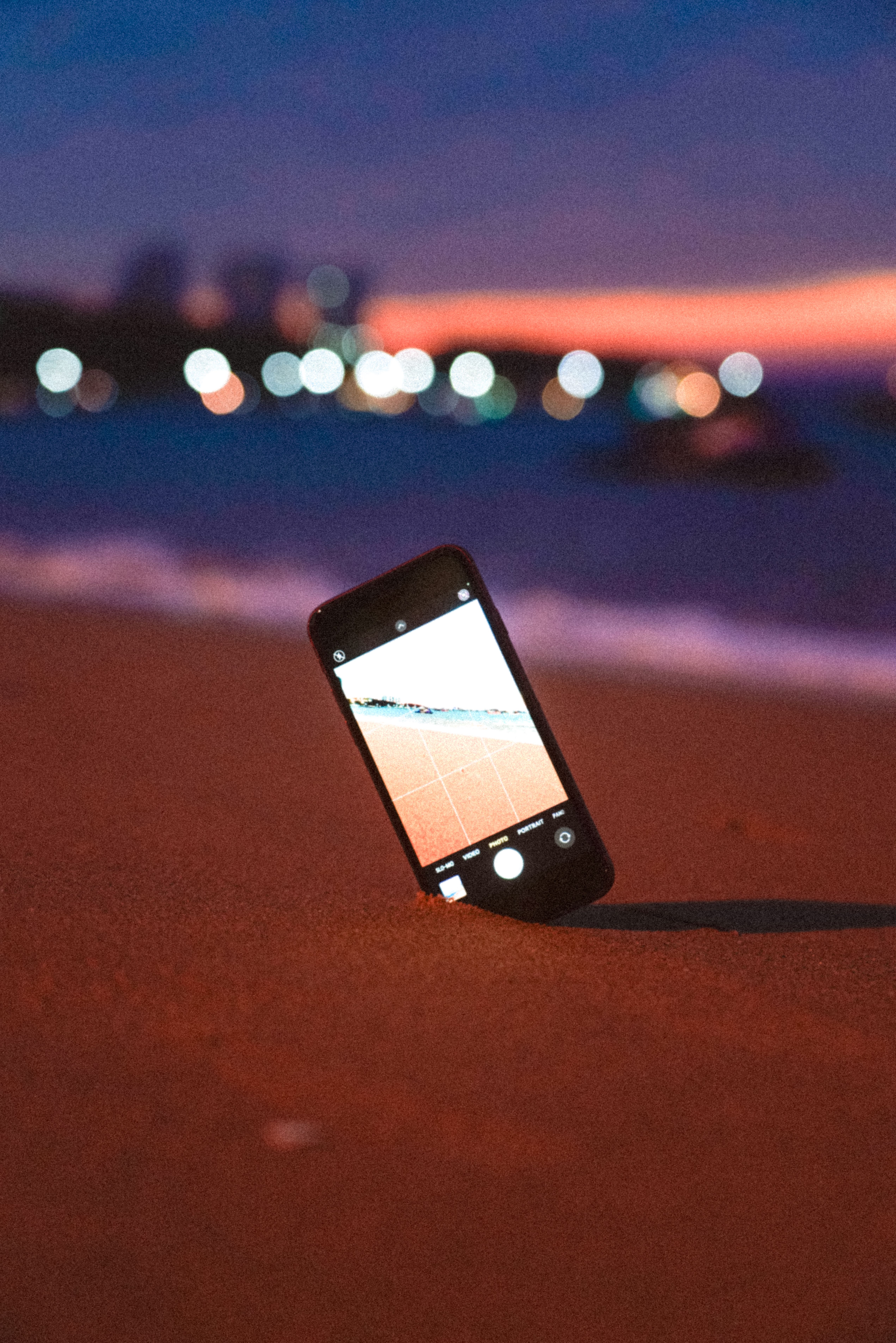 Mobile Phone on a Beach in the Evening · Free Stock Photo