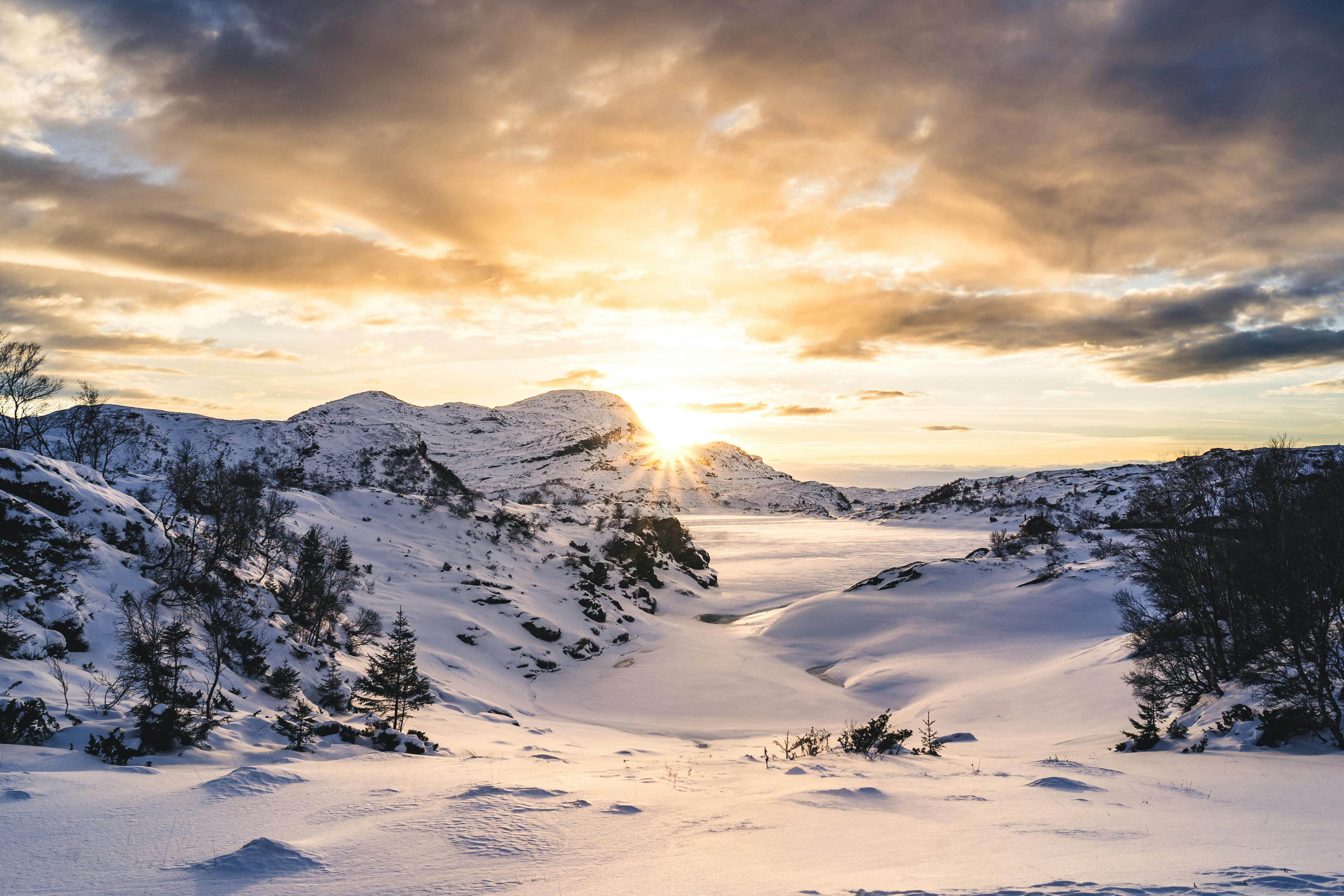 Mountain Valley Covered with Snow During Sunset · Free Stock Photo