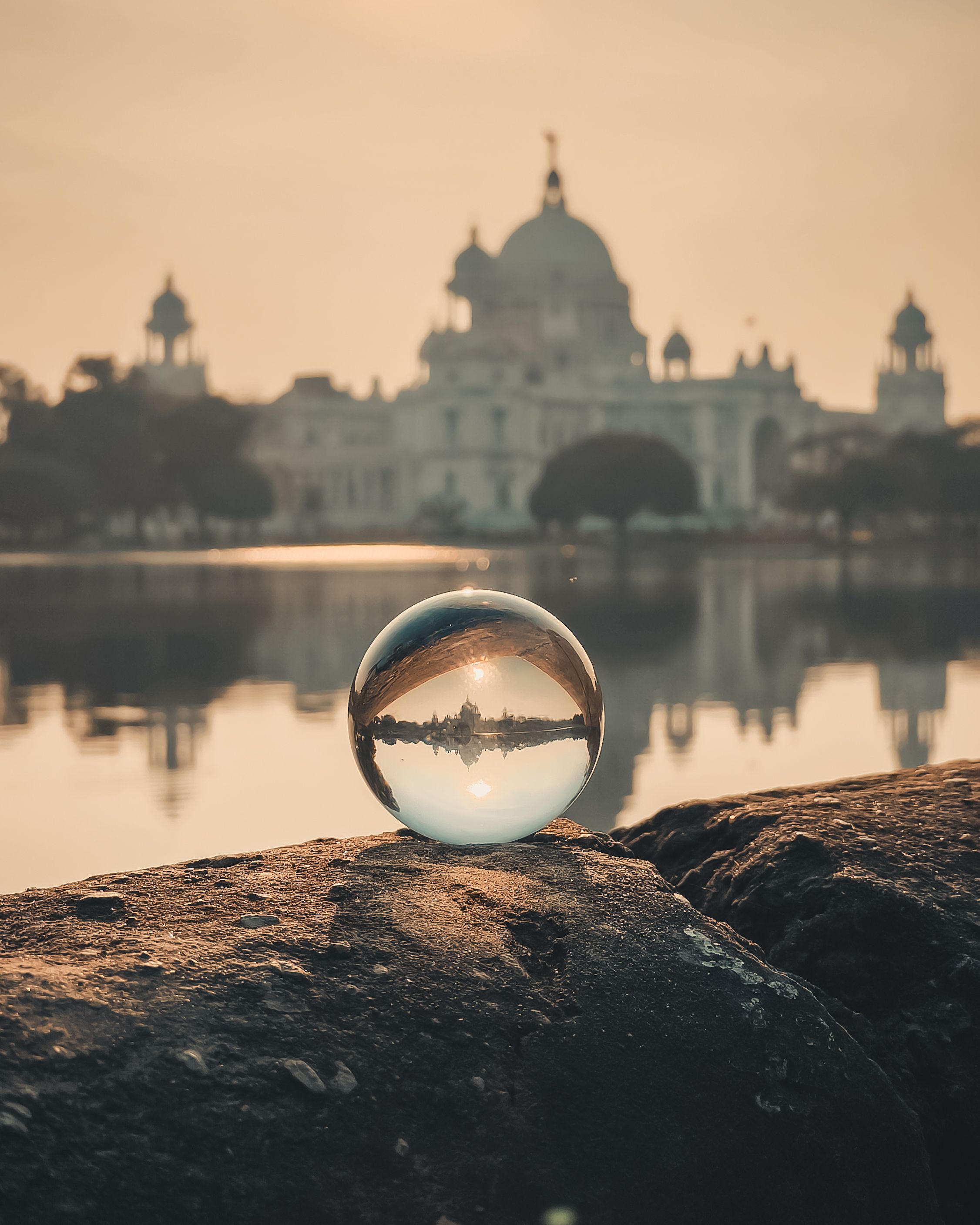 Monumental Building Reflecting in Crystal Ball Set on Stone · Free ...