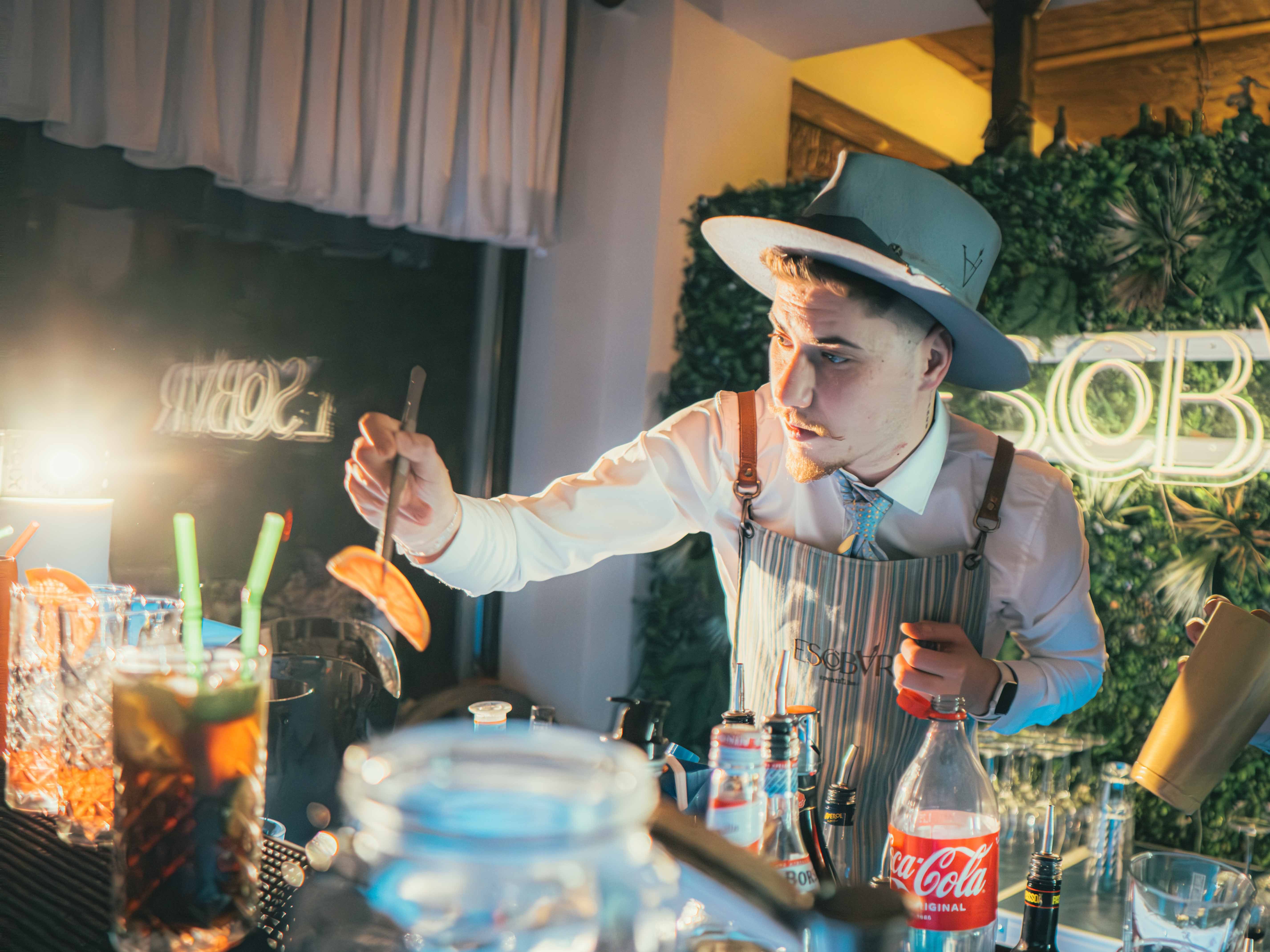 Photo of a Female Bartender Making a Drink · Free Stock Photo