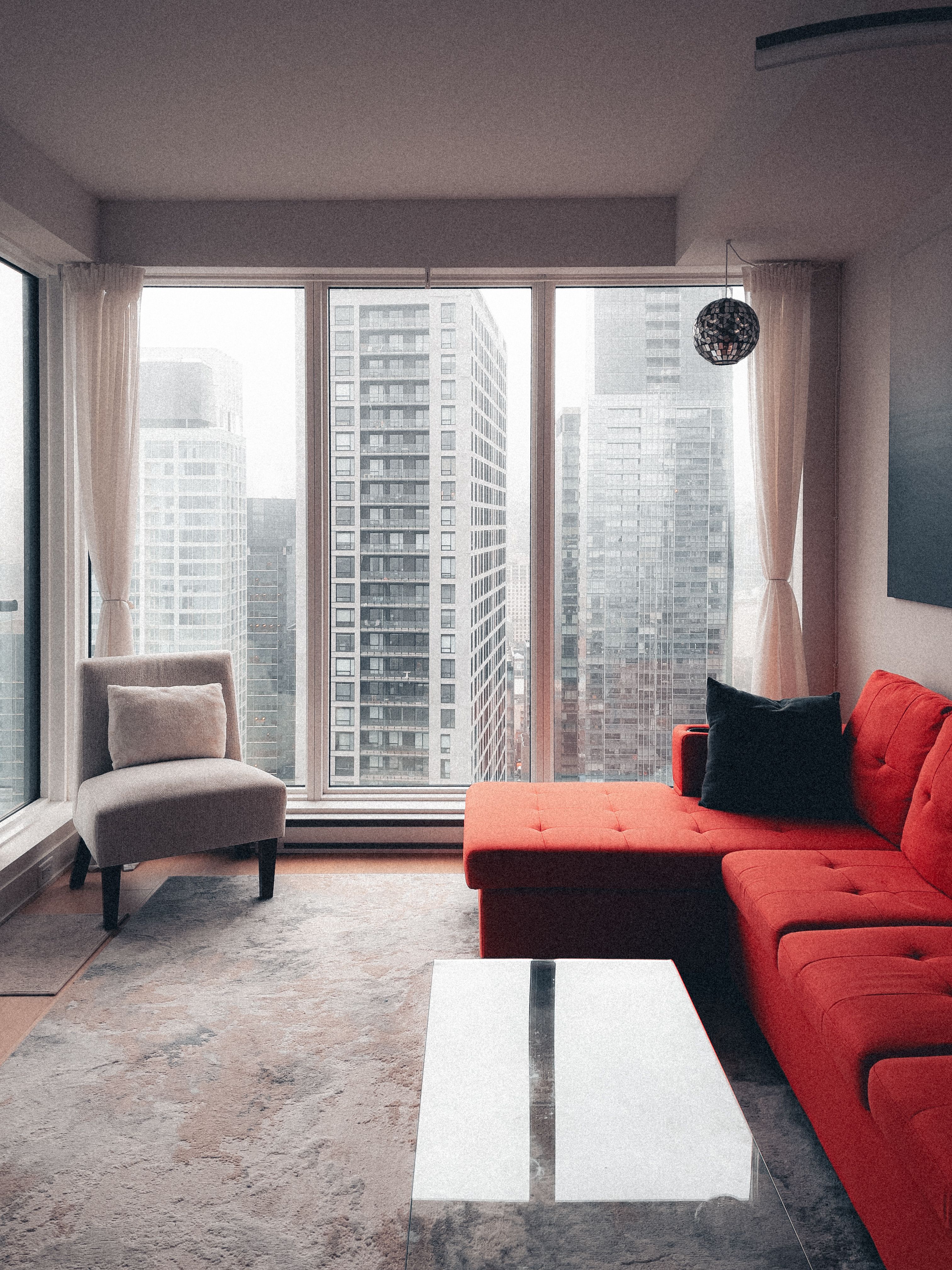 Living Room of a Corner Apartment in a Skyscraper · Free Stock Photo