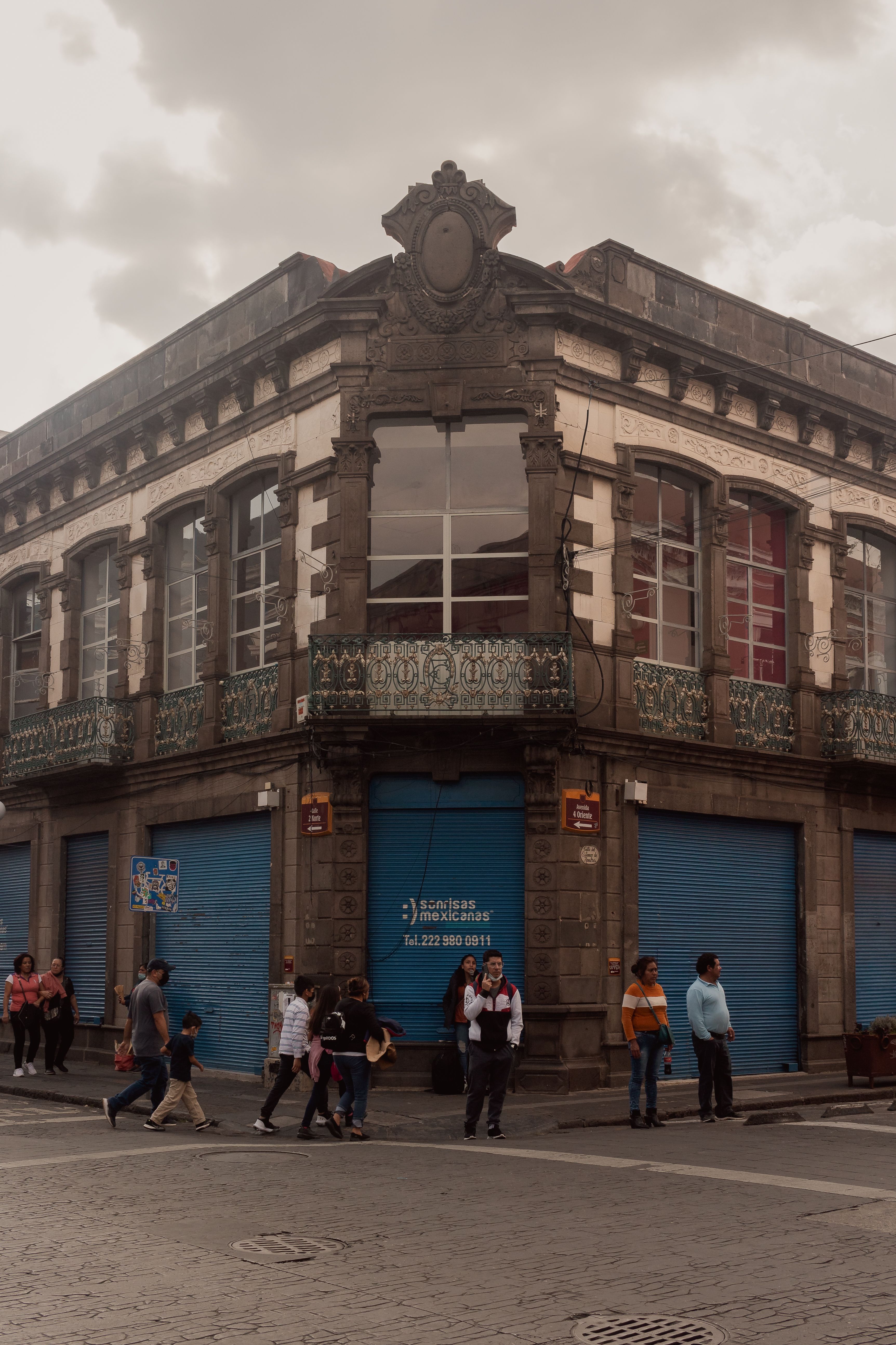 People in Front of Traditional Tenement · Free Stock Photo