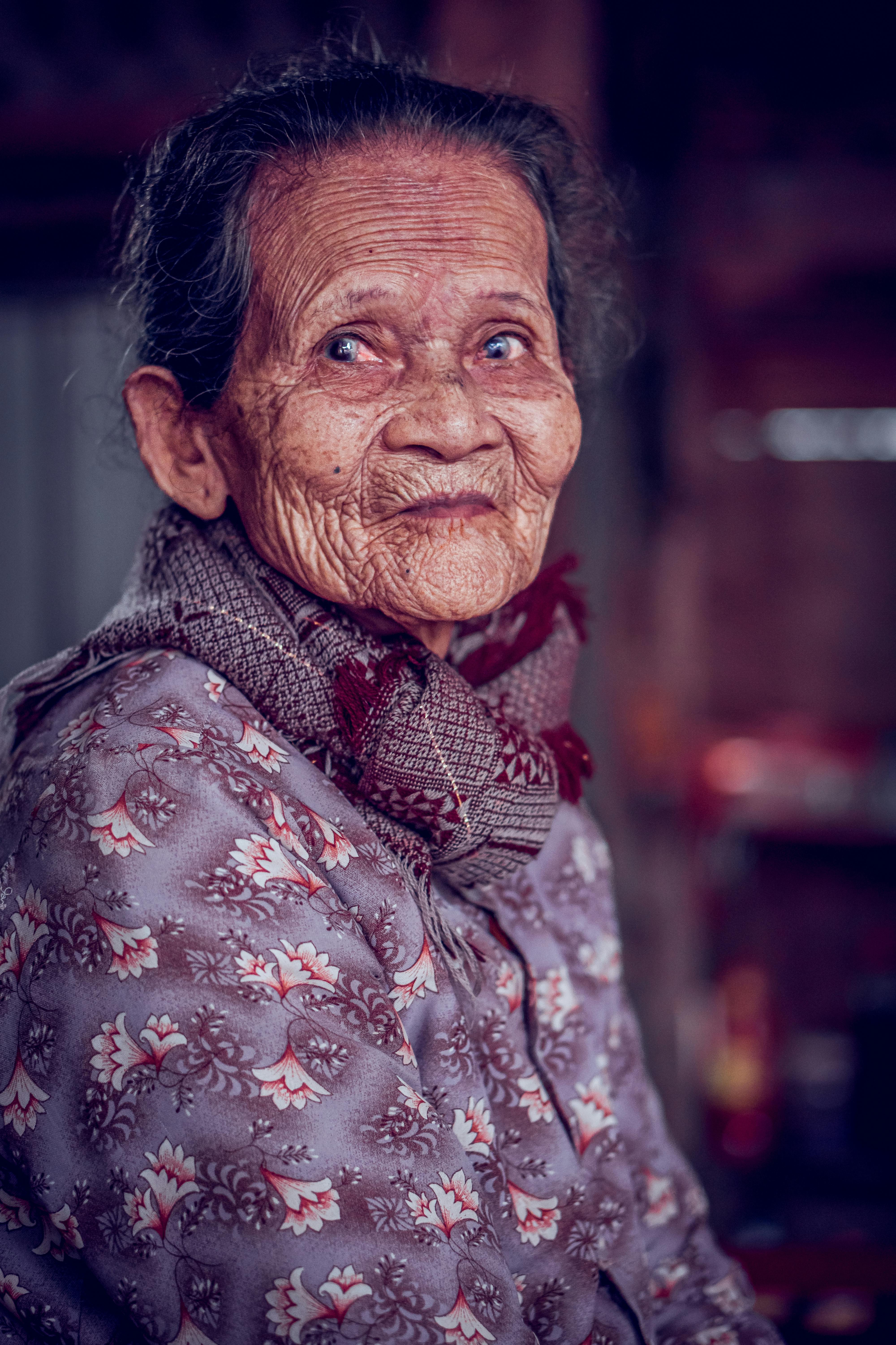 An old woman with a scarf on her head · Free Stock Photo