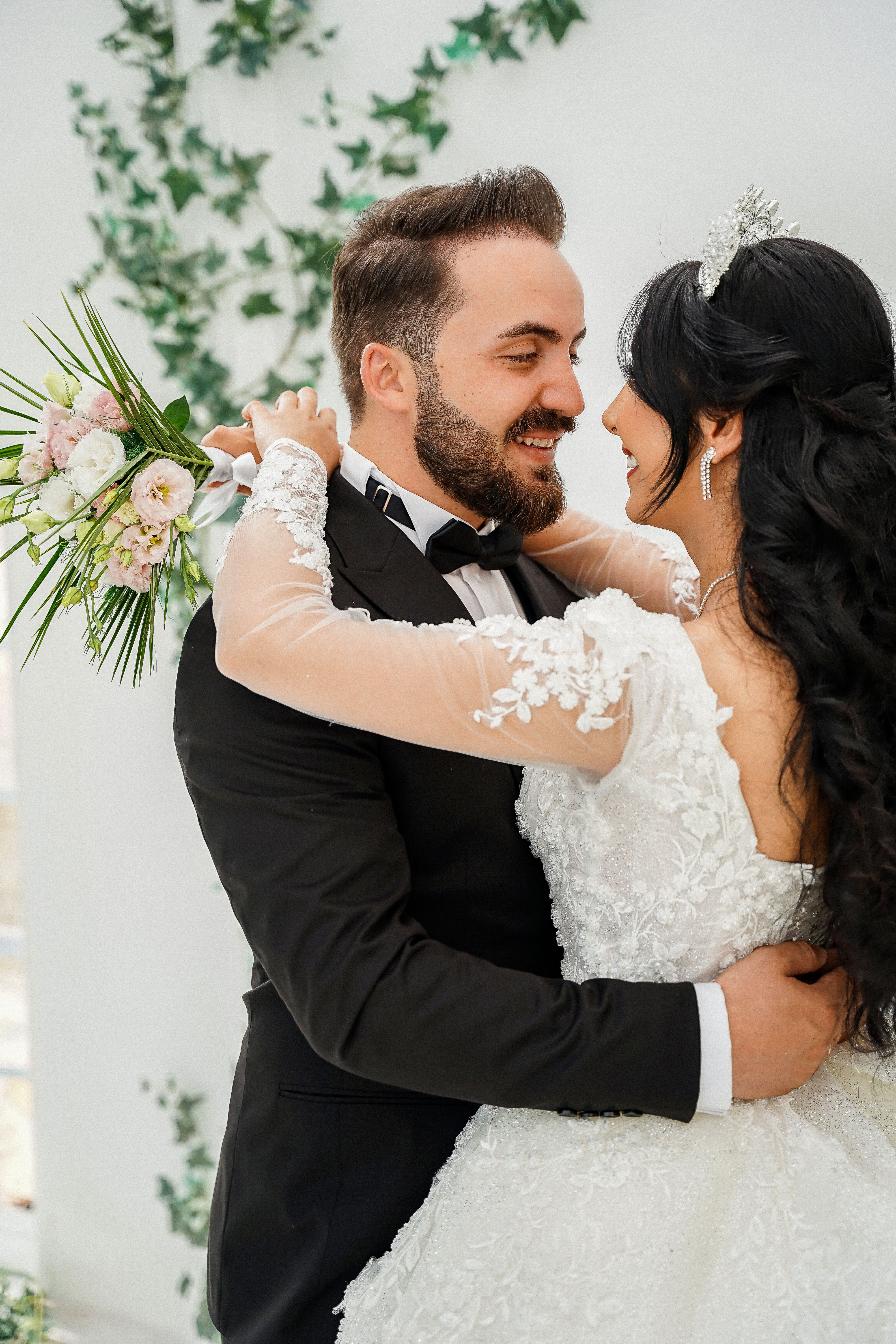 Smiling Groom Embracing his Bride · Free Stock Photo