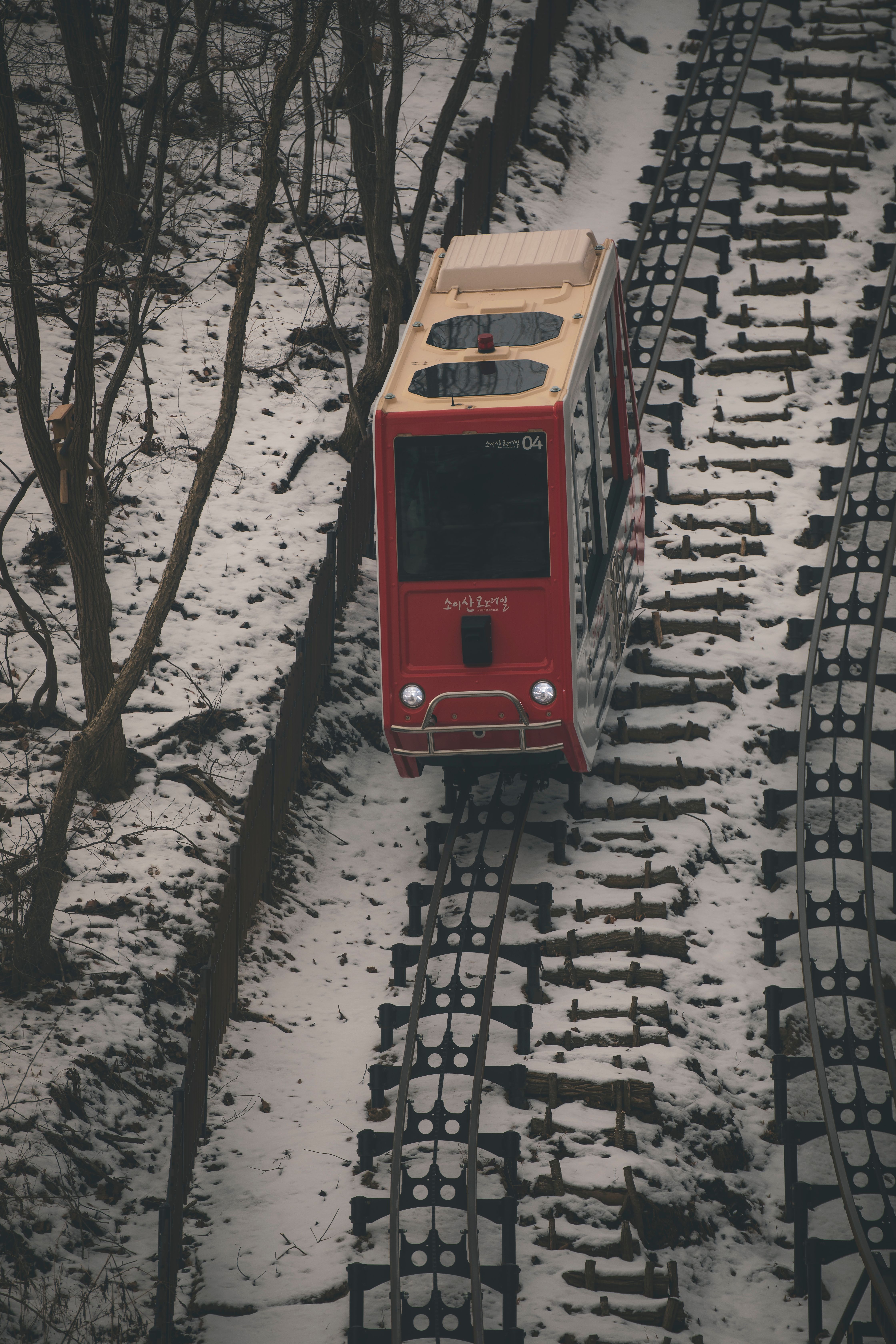 Tram on Tracks Covered with Snow · Free Stock Photo