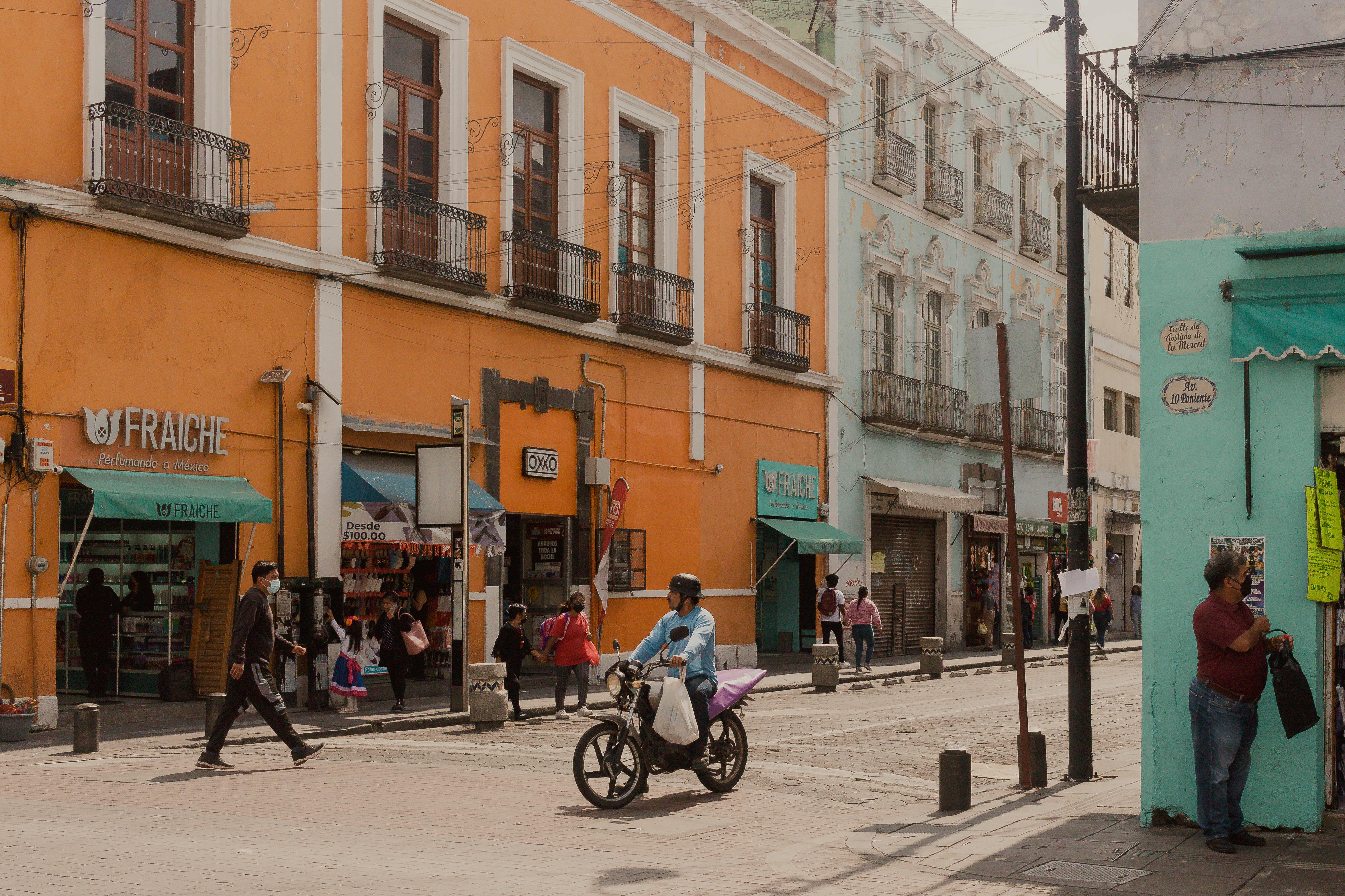 Man on Motorbike on Street in Puebla · Free Stock Photo