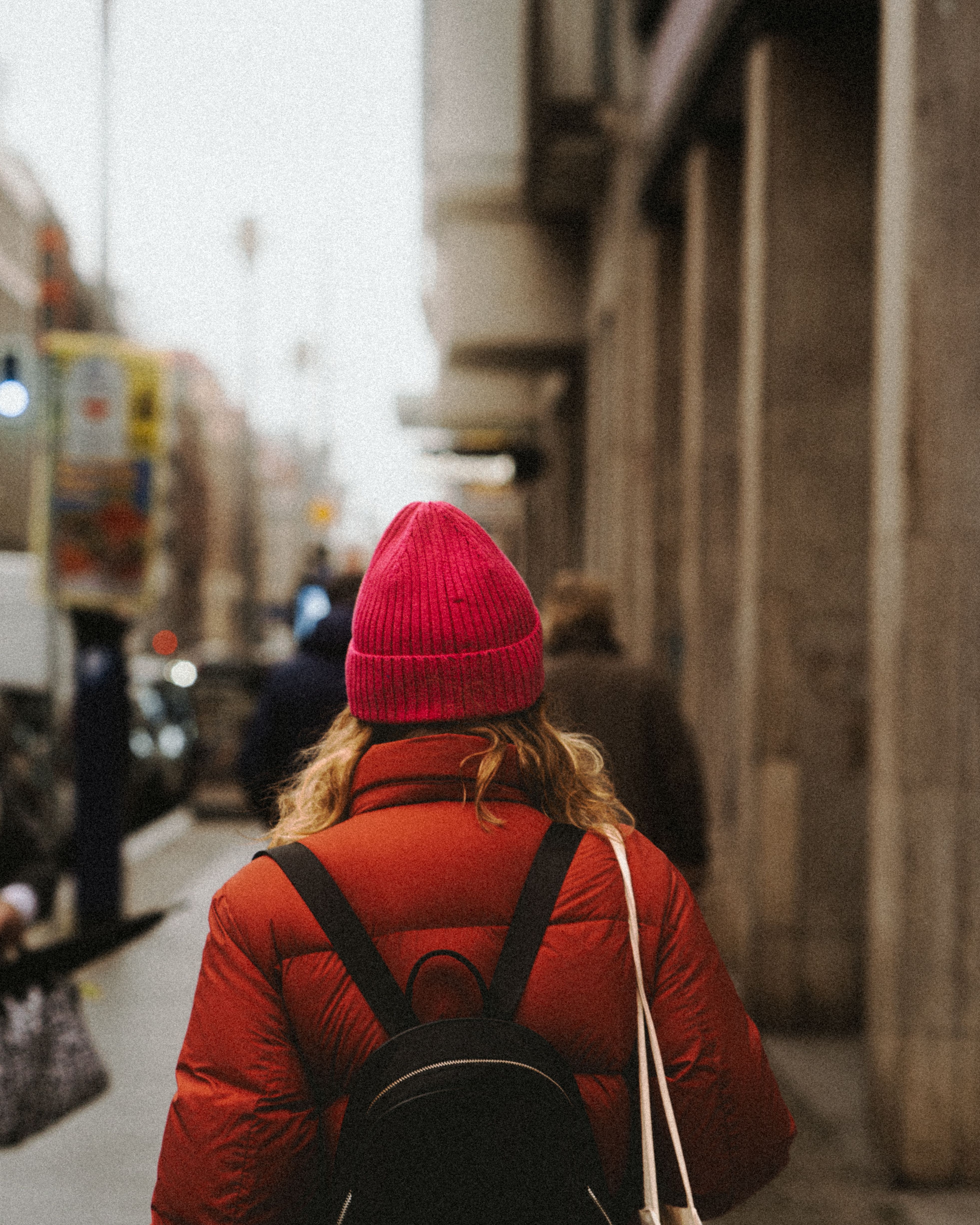 Woman Wearing Red Jacket on a Street · Free Stock Photo