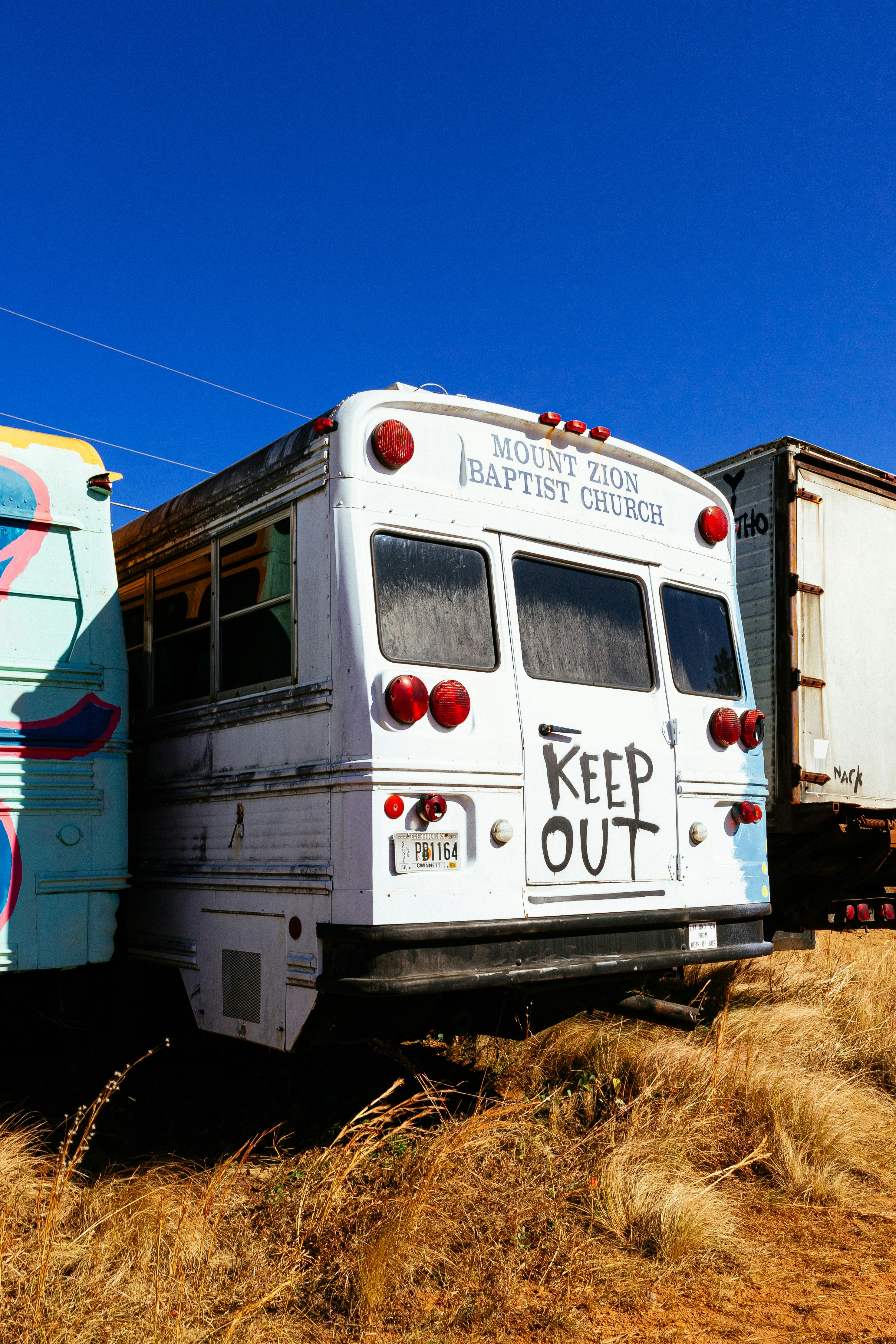 Back of White Shuttle Bus · Free Stock Photo