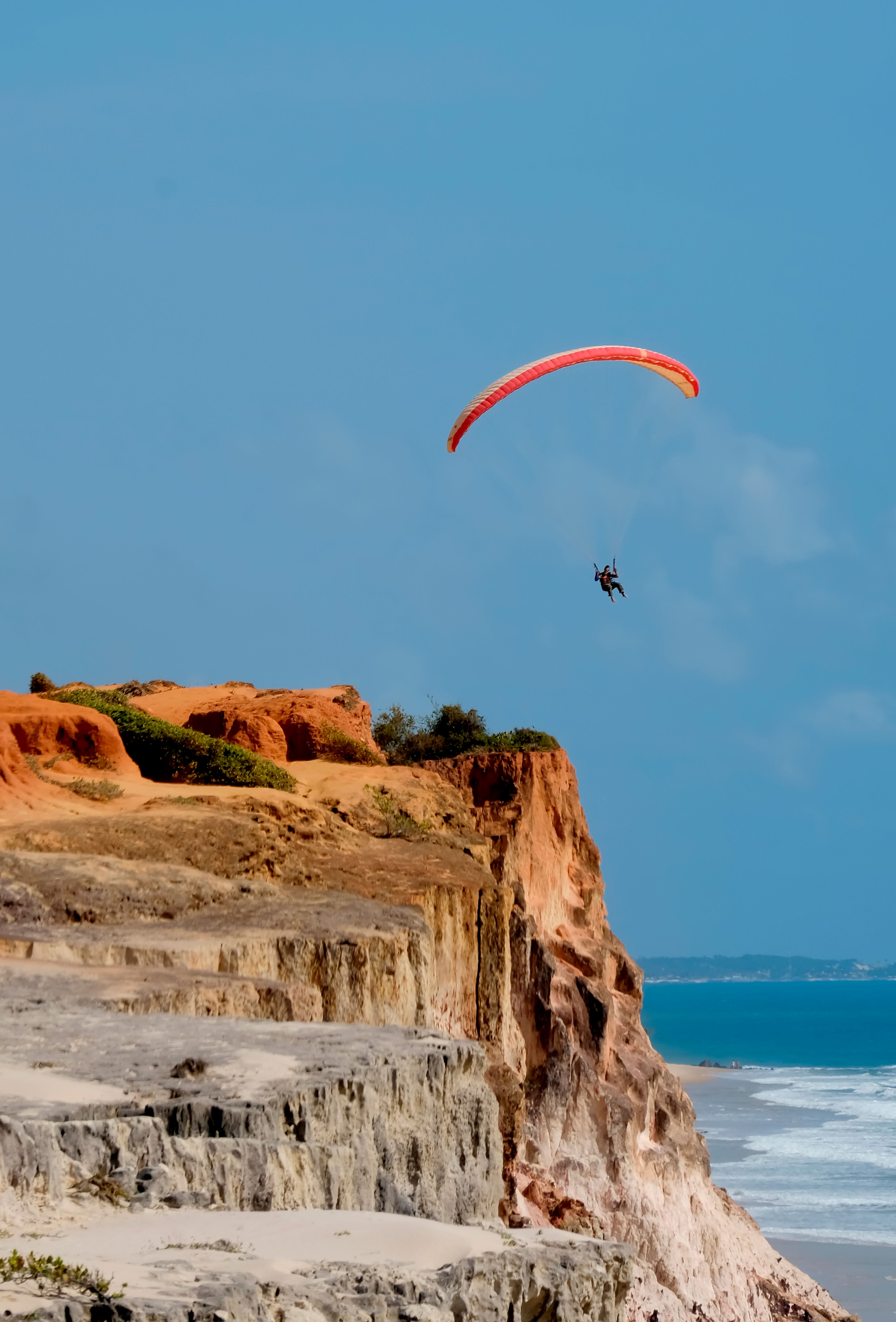 Parachuting over Cliff on Sea Shore · Free Stock Photo