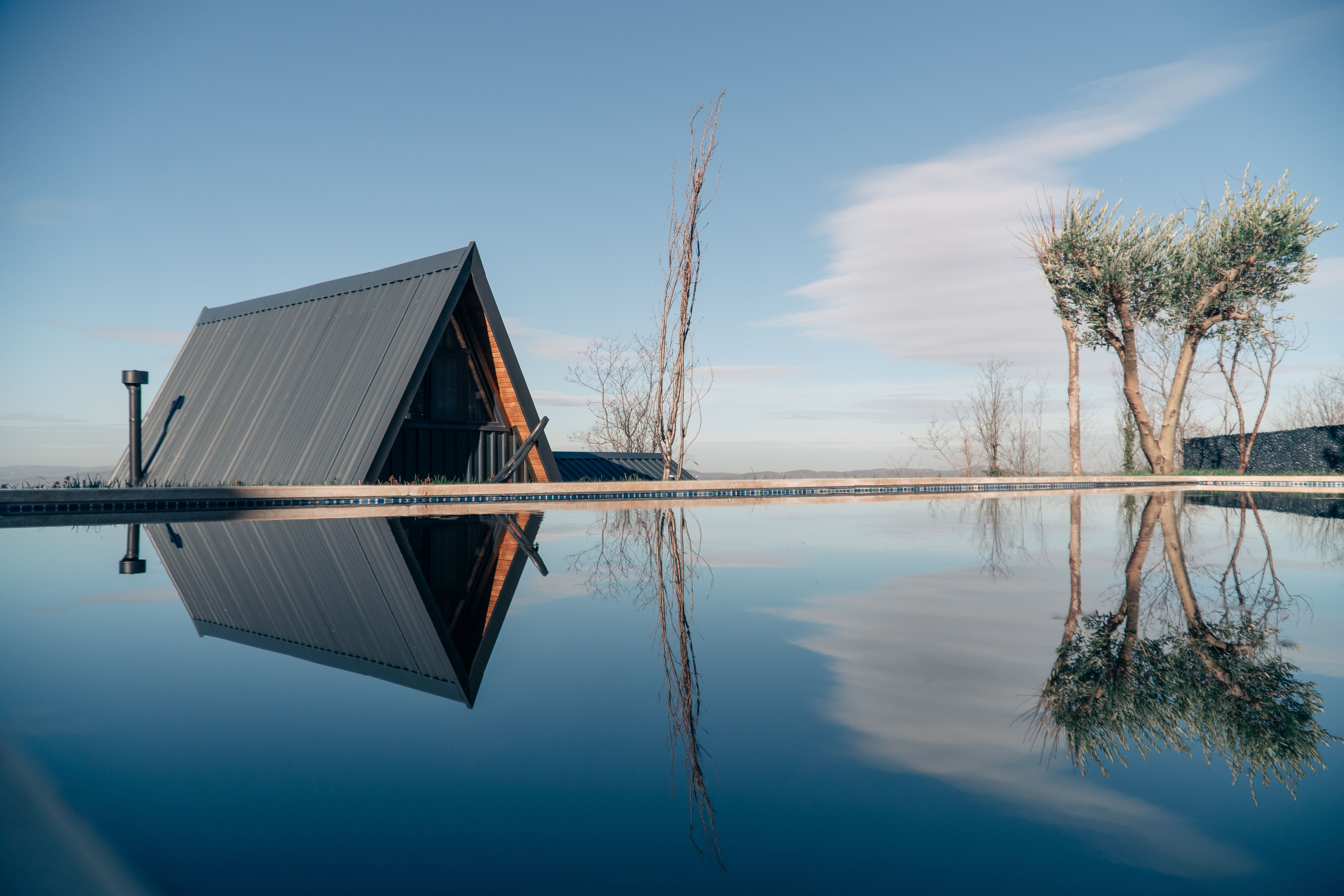 Swimming Pool Behind Modern House · Free Stock Photo