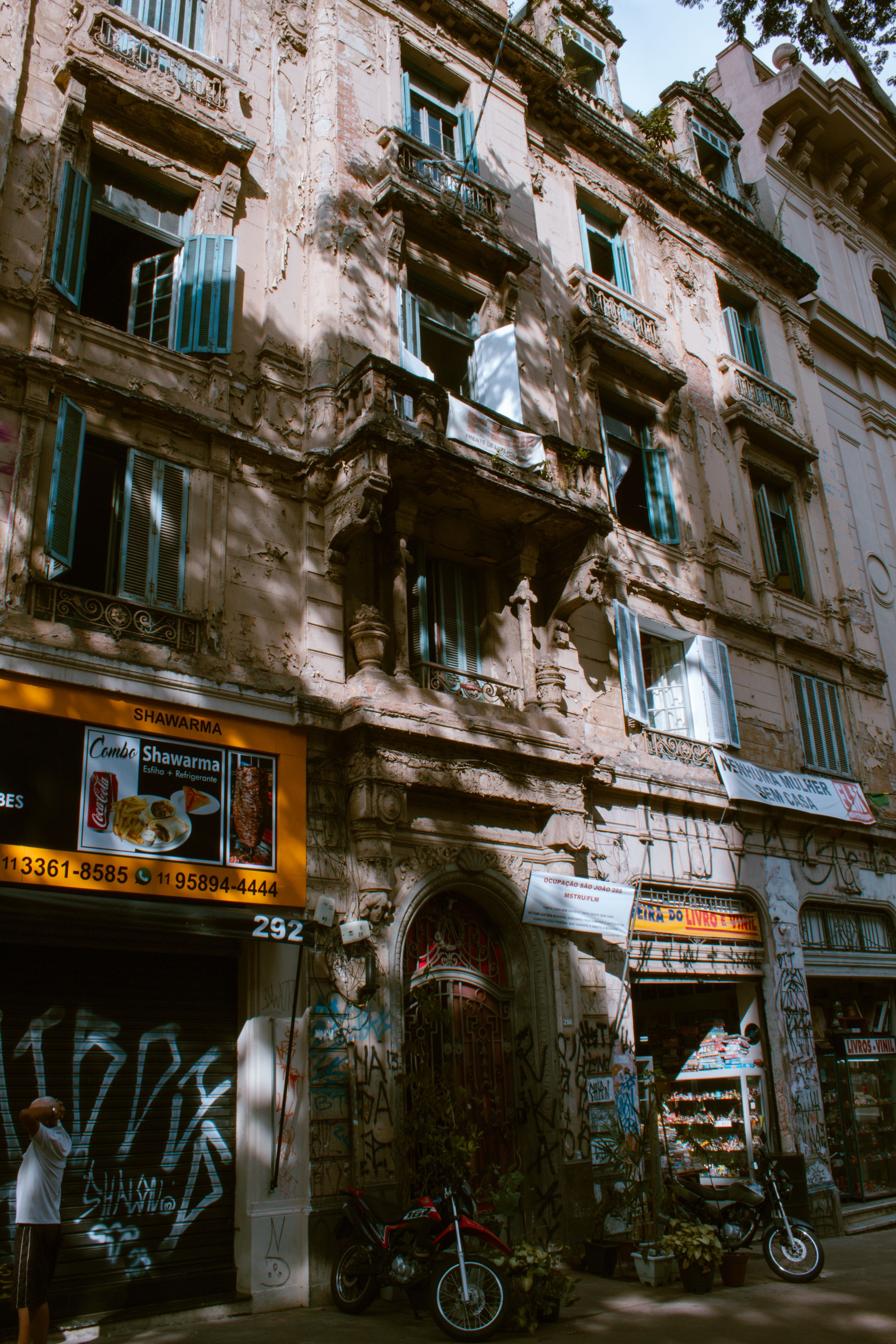 Townhouse facade with shadows of tree branches · Free Stock Photo
