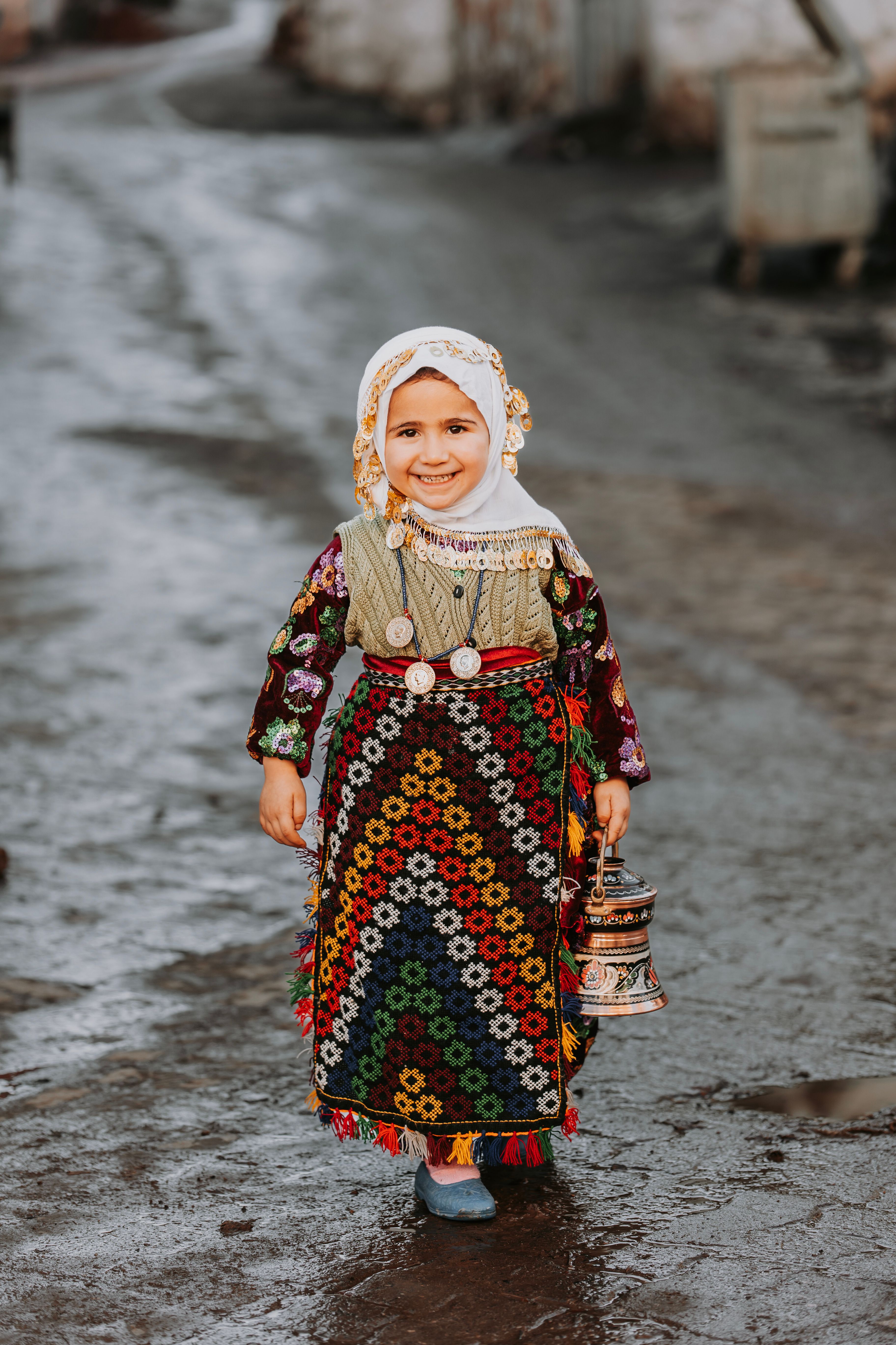Little Girl in Traditional Clothing Standing in the Street · Free Stock ...