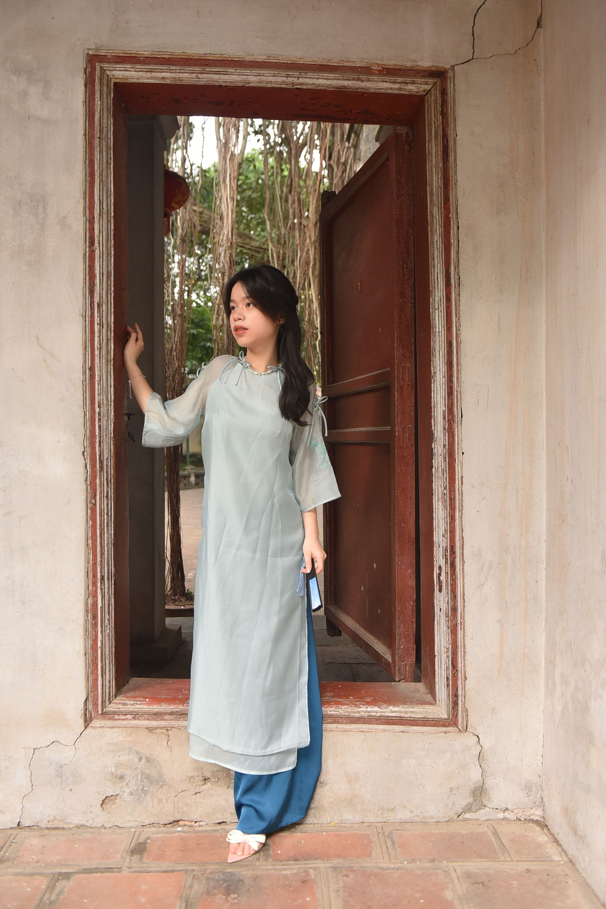Young Model in Vietnamese Traditional Dress Standing in a Doorway ...