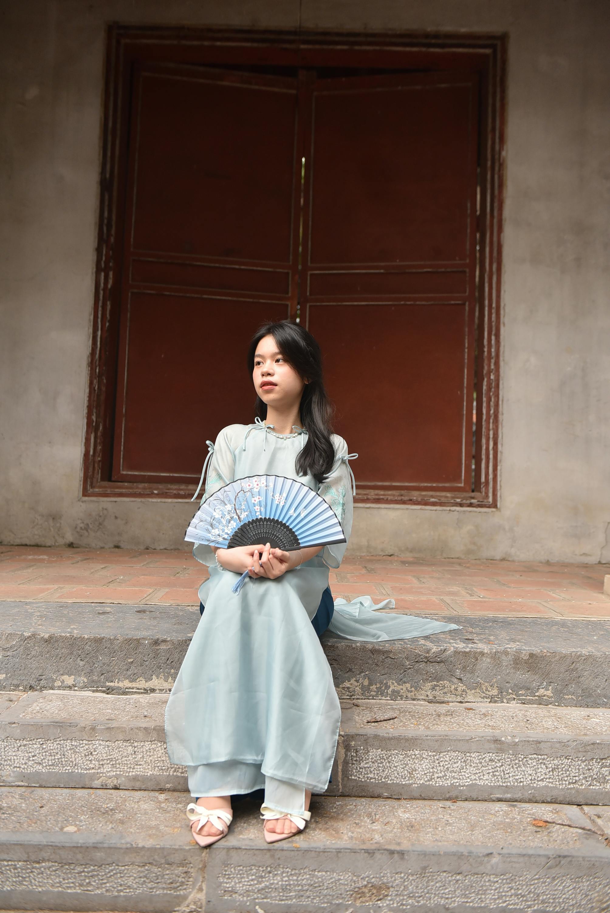 Young Model with Blue Paper Fan Wearing Traditional Vietnamese Dress ...