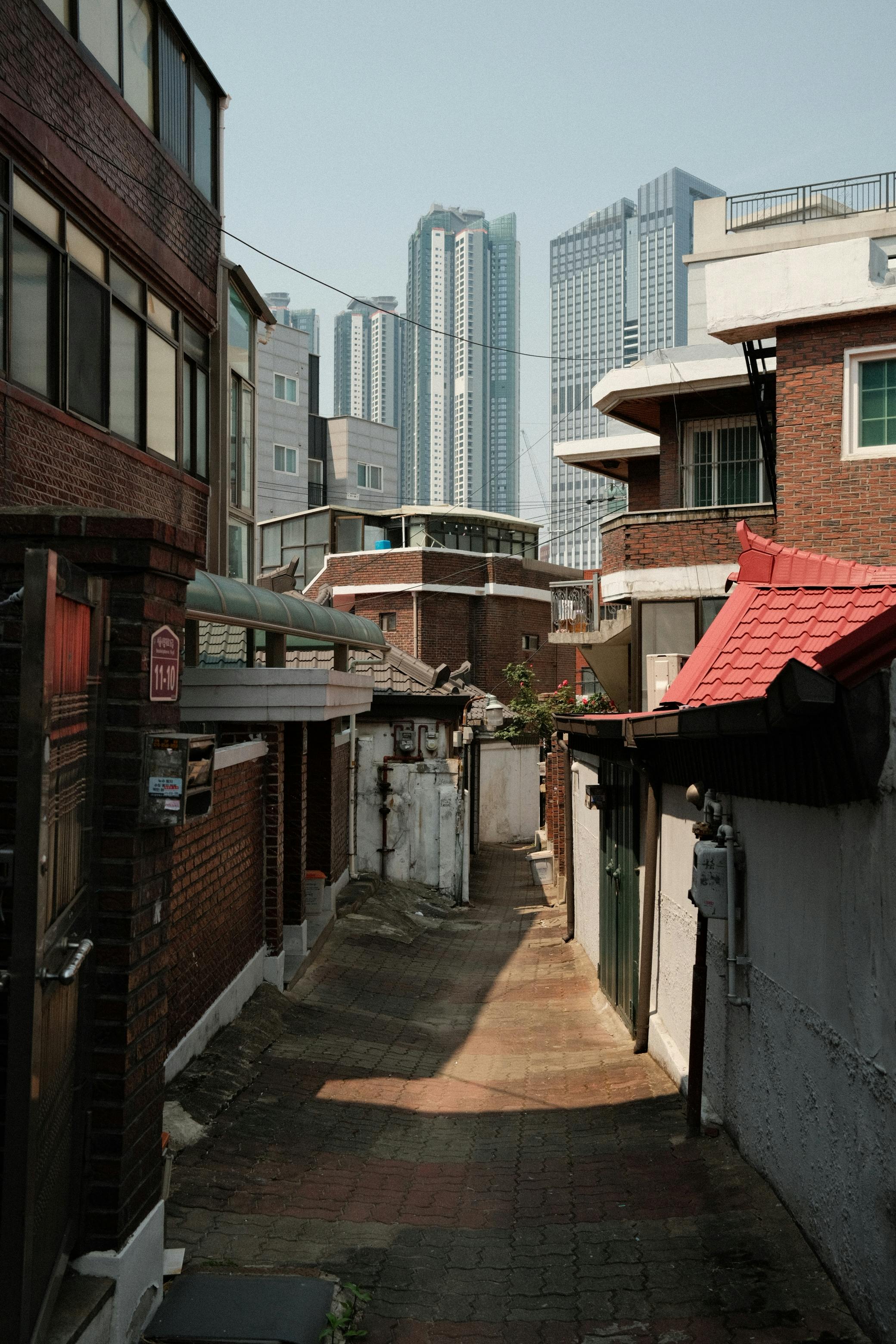 Back Street Overlooking City Skyscrapers · Free Stock Photo