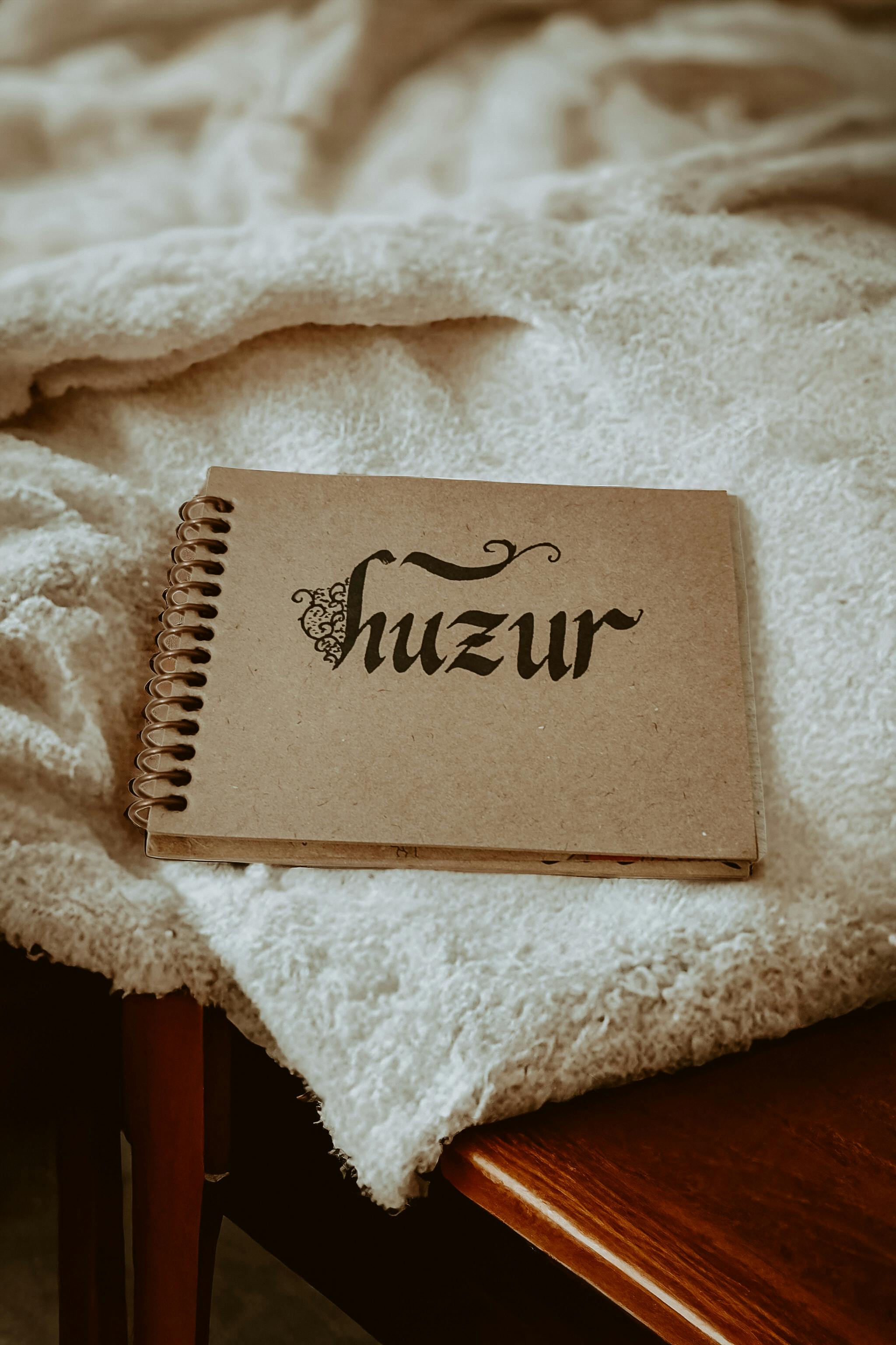 Close-up of a Notebook on a Blanket · Free Stock Photo