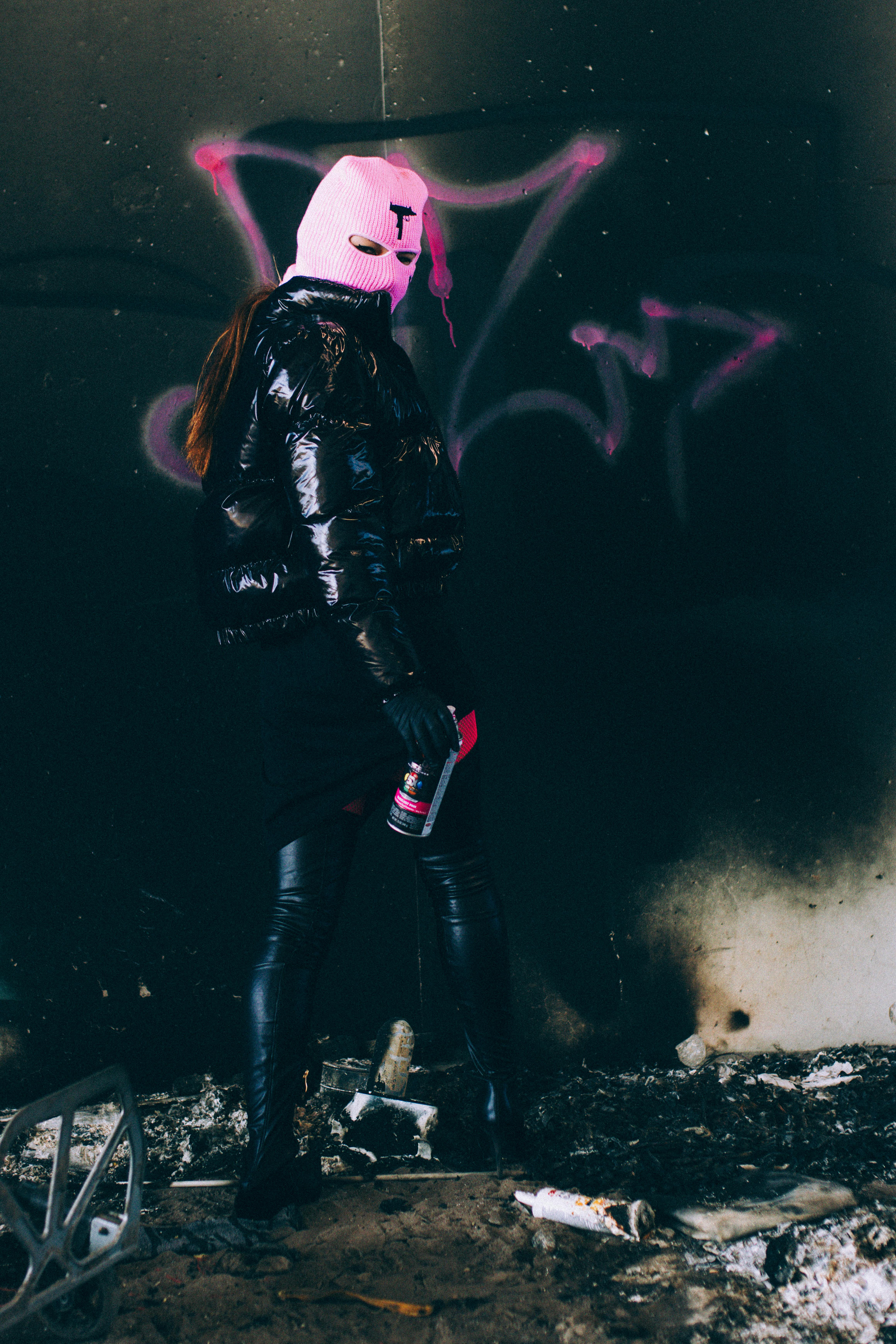 Woman in a Pink Balaclava Spray-painting a Graffiti Tag · Free Stock Photo