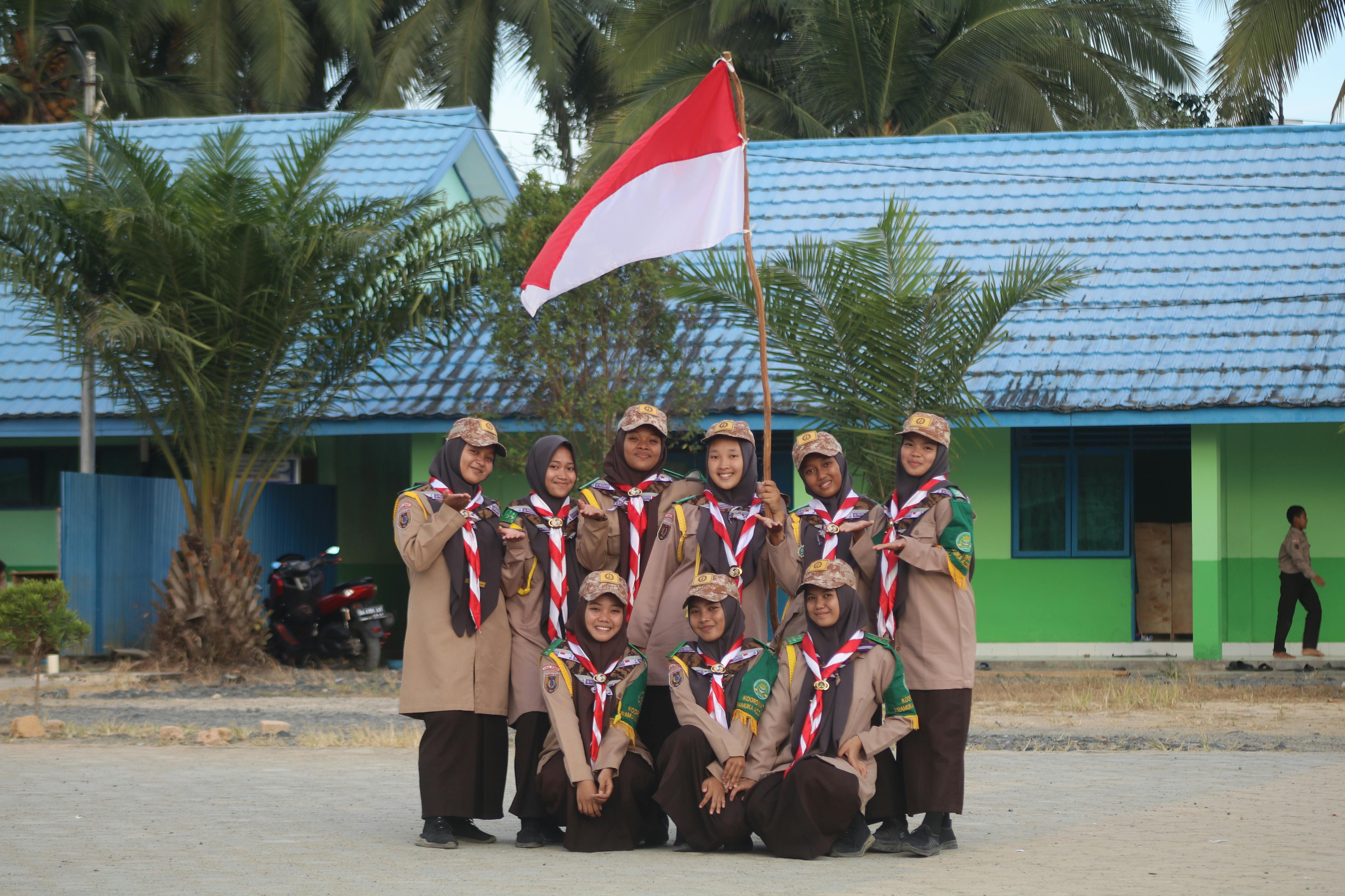 Scouts Posing with a Flag · Free Stock Photo