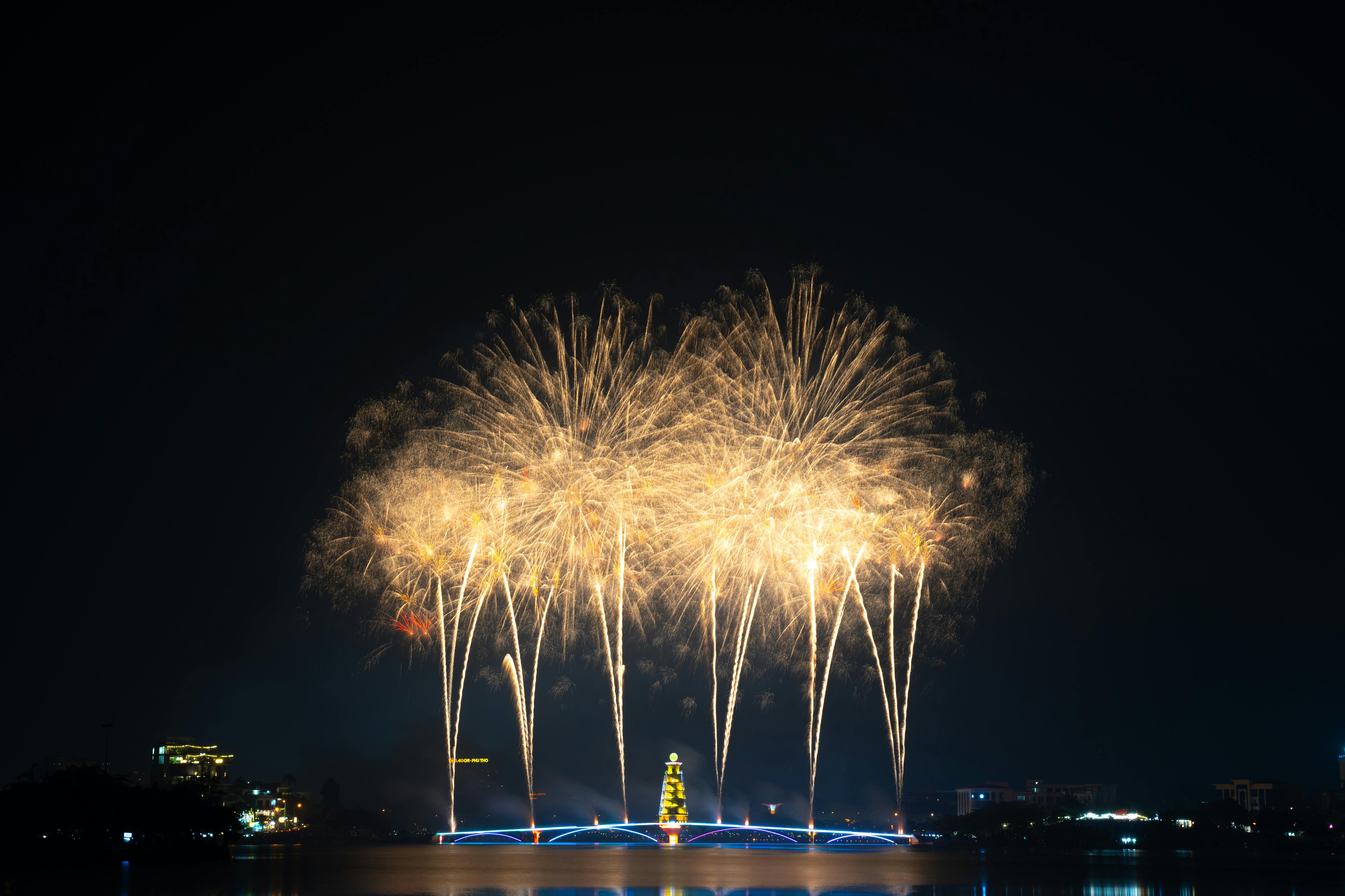 Fireworks in Night Sky over City at New Year · Free Stock Photo