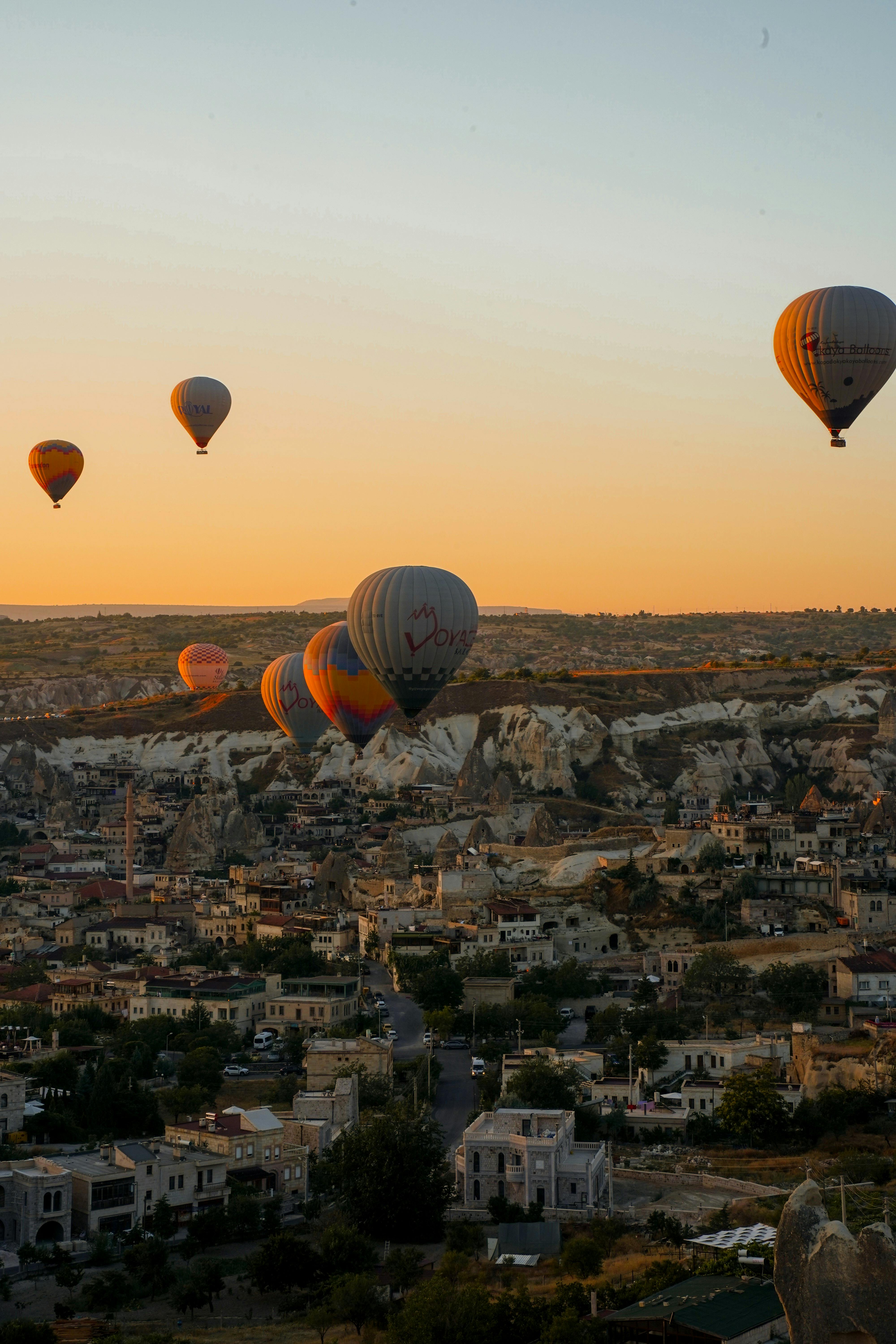 Hot Air Balloons Flying over Town in Cappadoccia, Turkey · Free Stock Photo