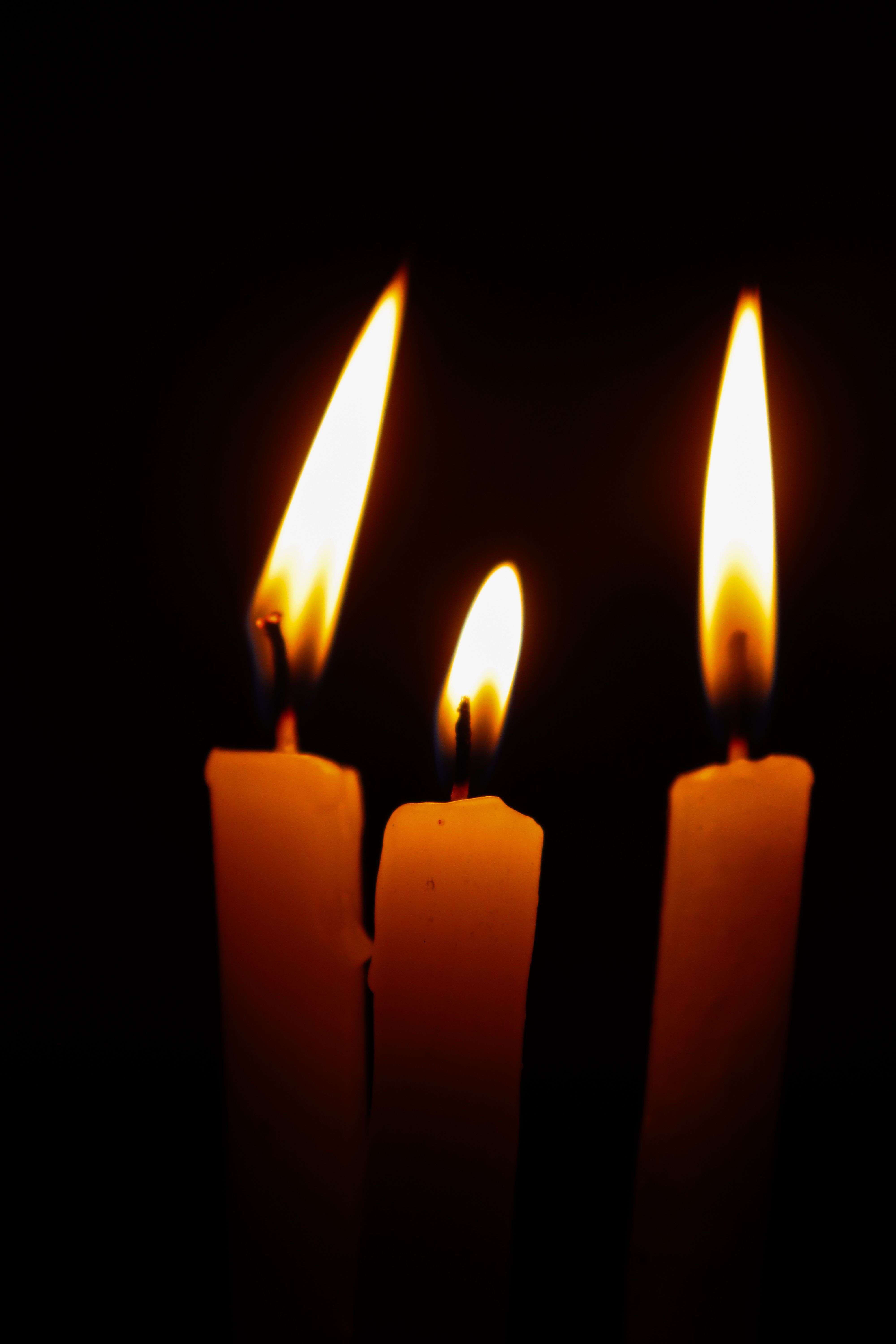 Close Up Photo of a Lighted Candle · Free Stock Photo