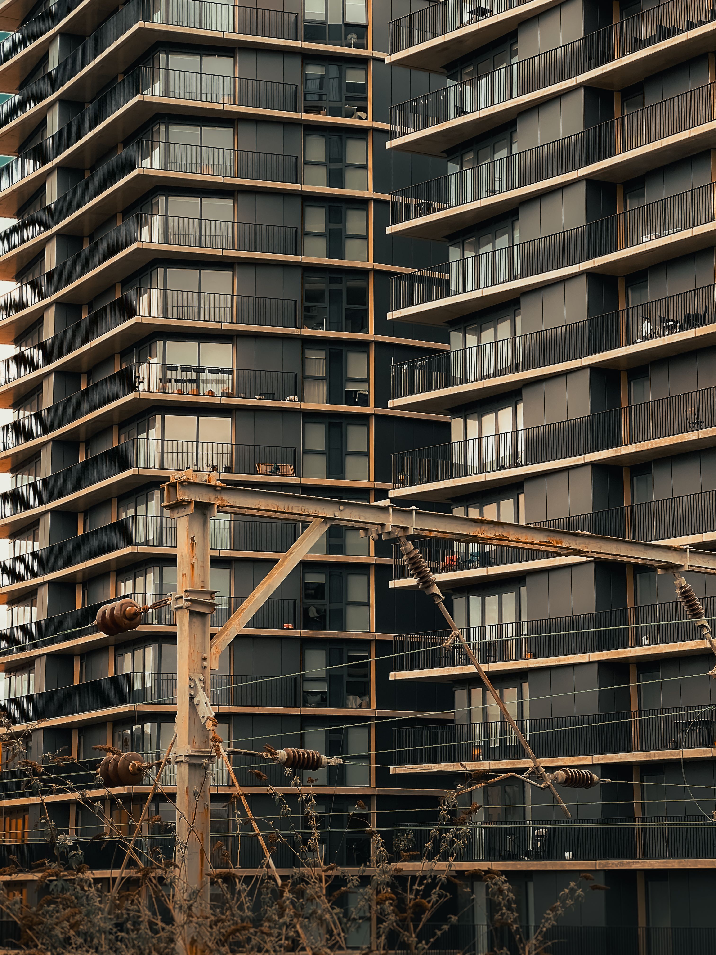 Railway Cables with Modern Buildings in the Background · Free Stock Photo