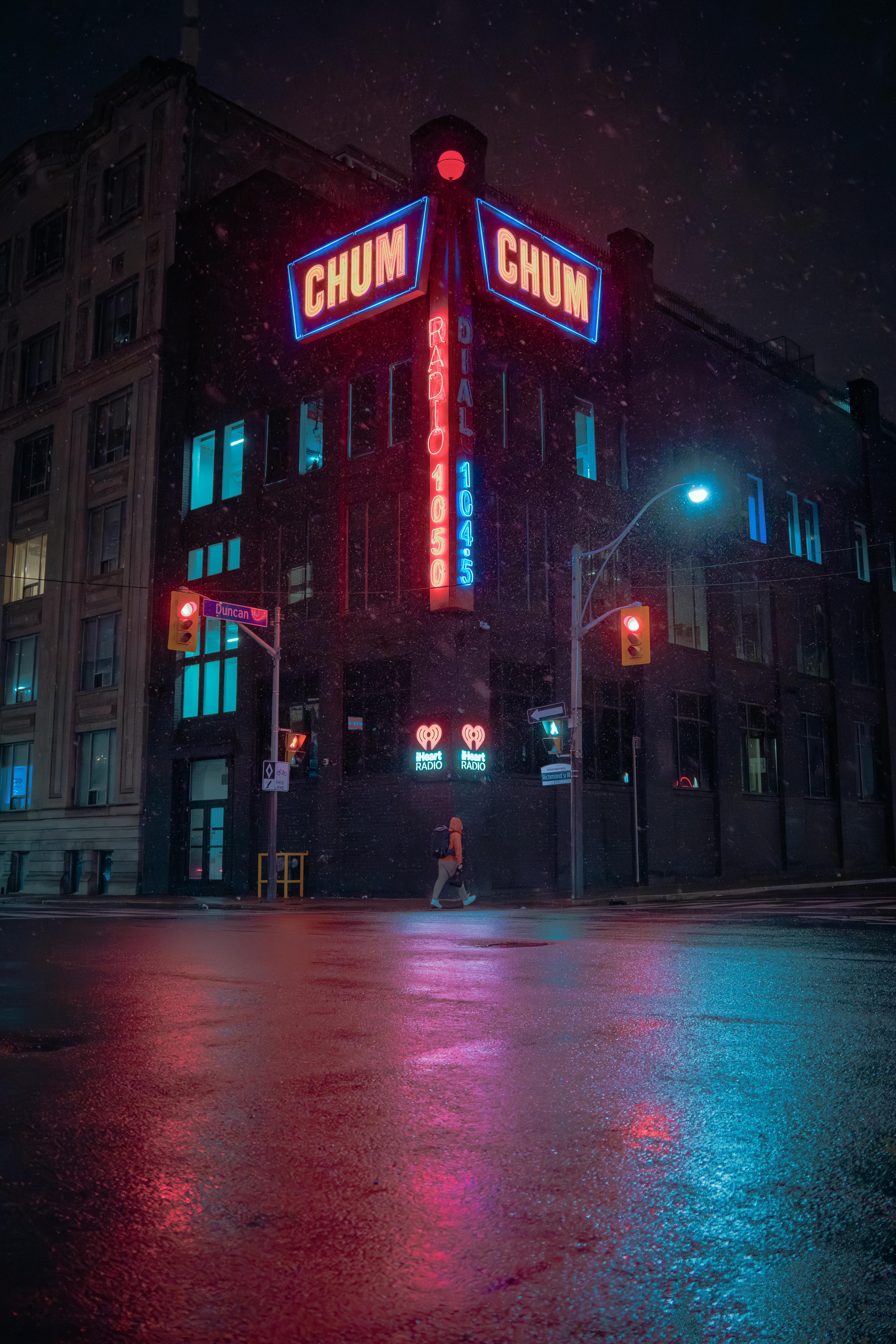A Phone Booth with Reflecting Neon Sign · Free Stock Photo