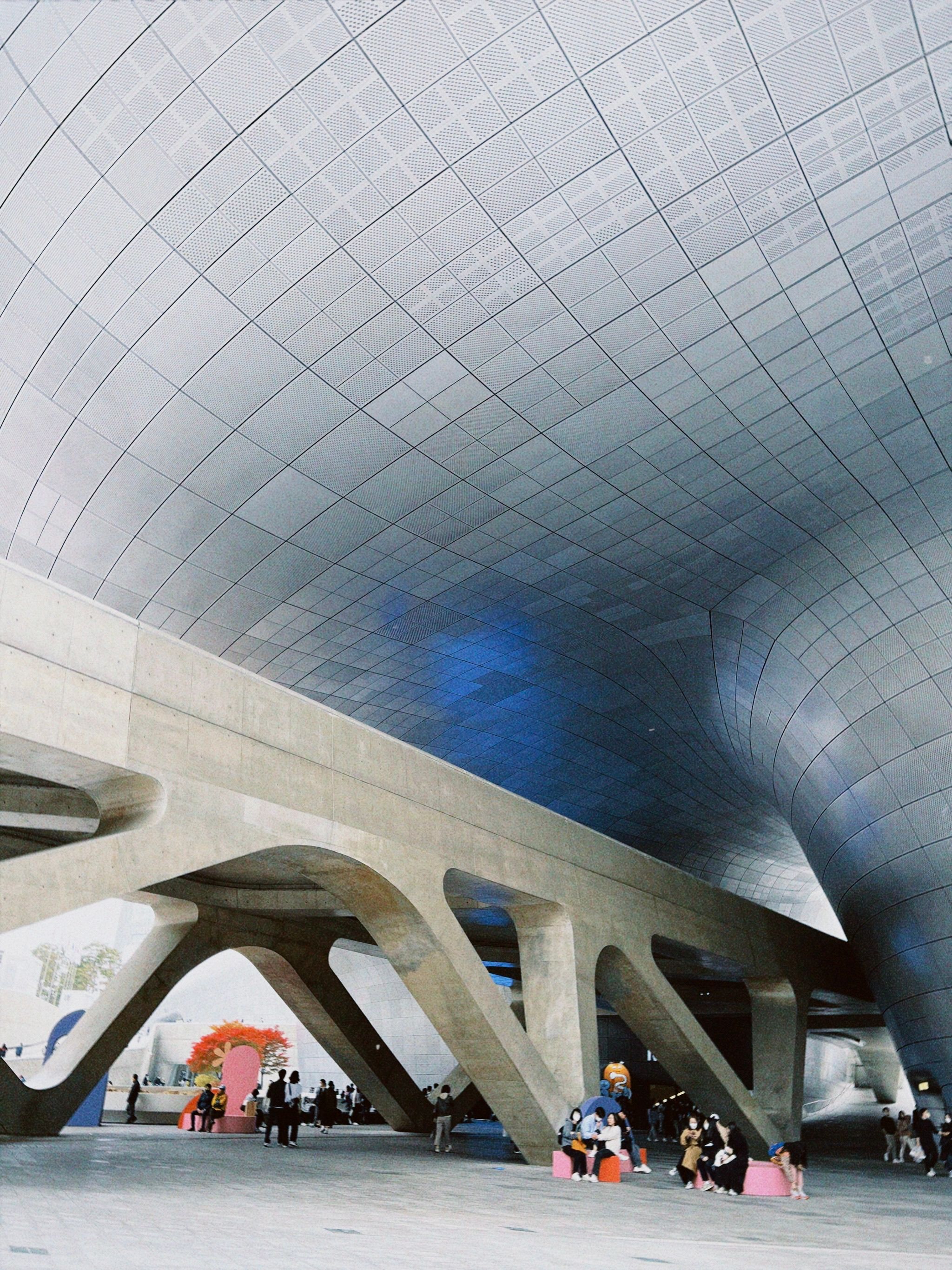 People Sitting under Modern Ceiling · Free Stock Photo