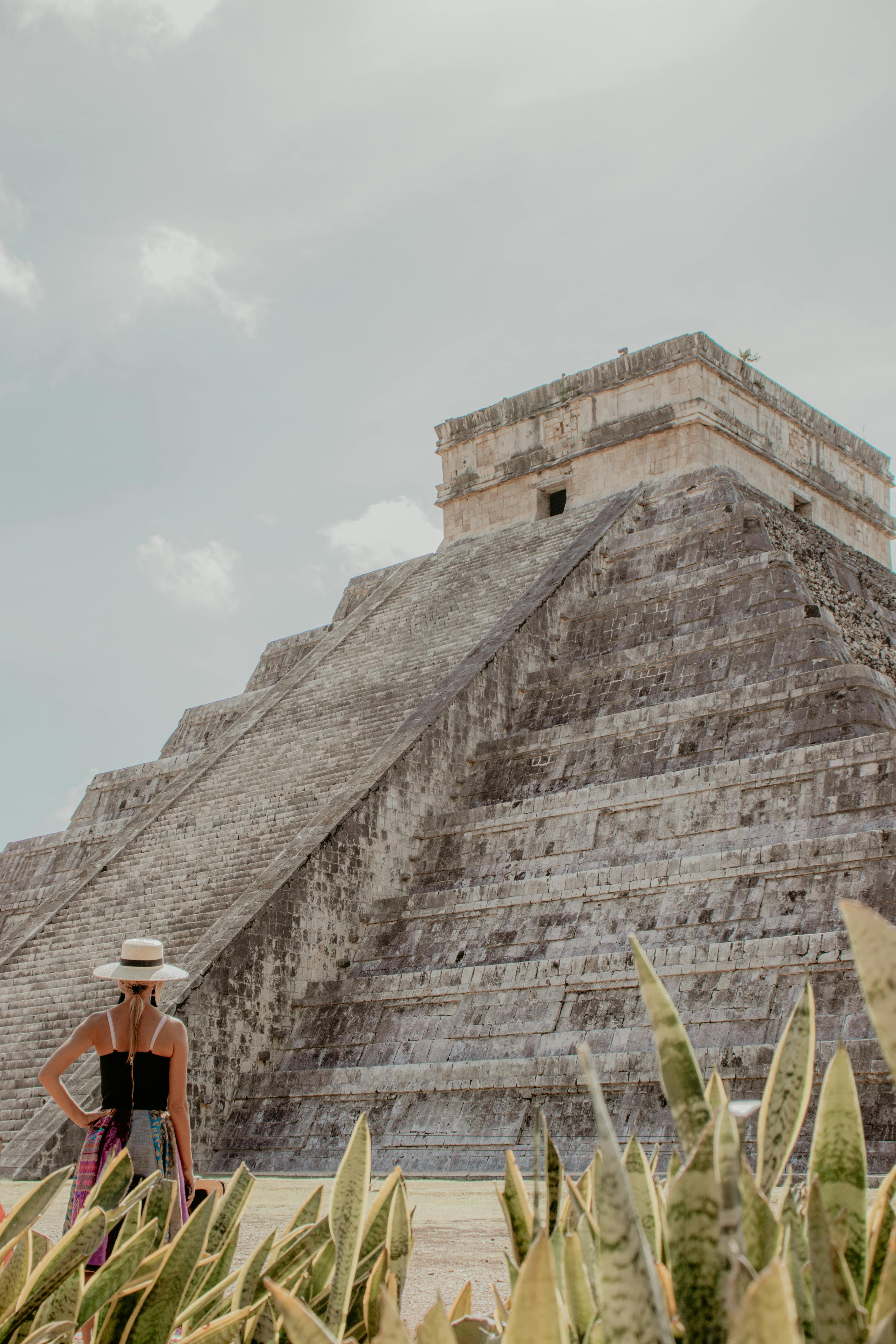 Woman in Straw Hat Standing near Kukulcan Temple Pyramid in Chichén ...