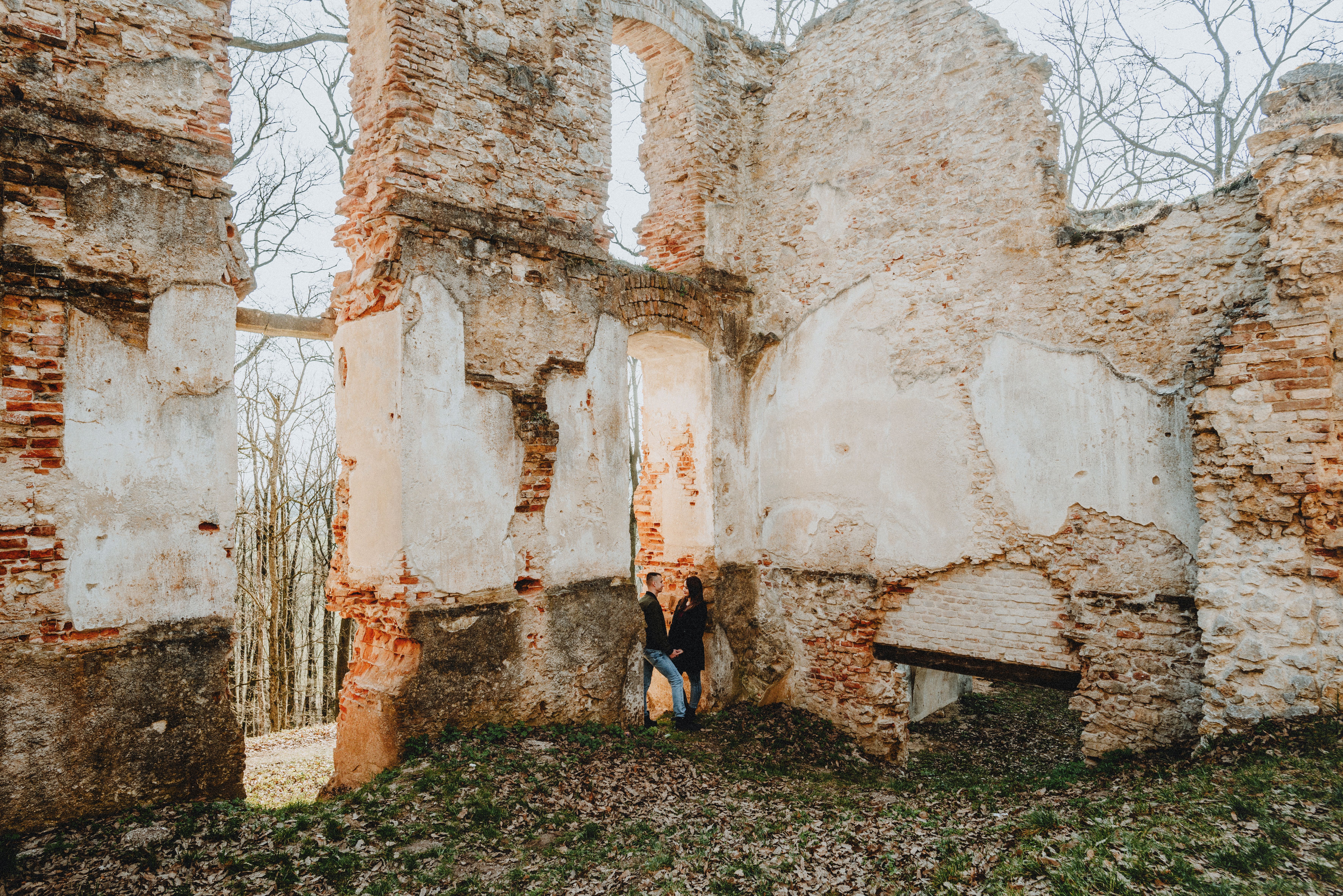 Couple Standing among Old Ruins · Free Stock Photo