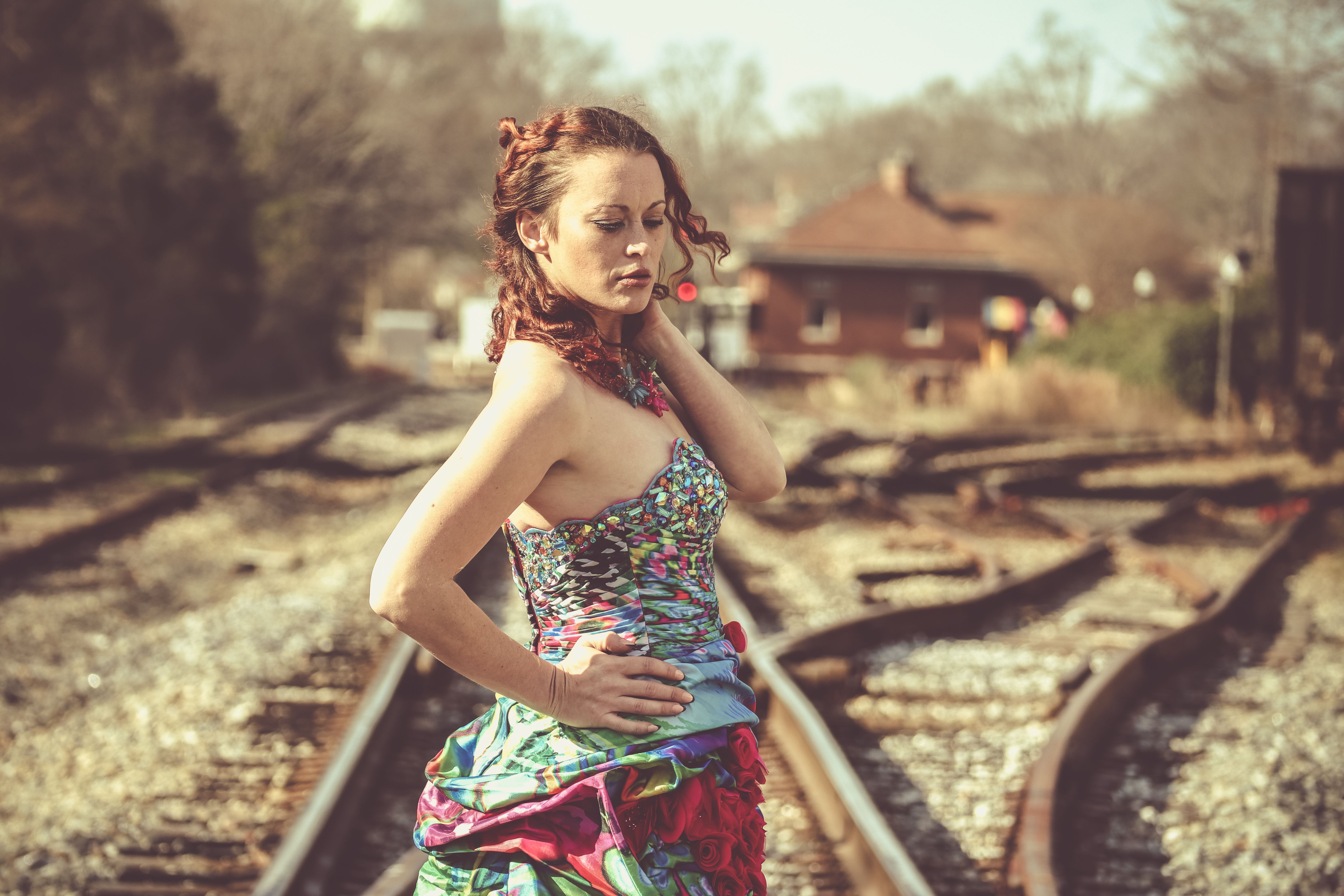 A Woman Posing on a Railway Track · Free Stock Photo