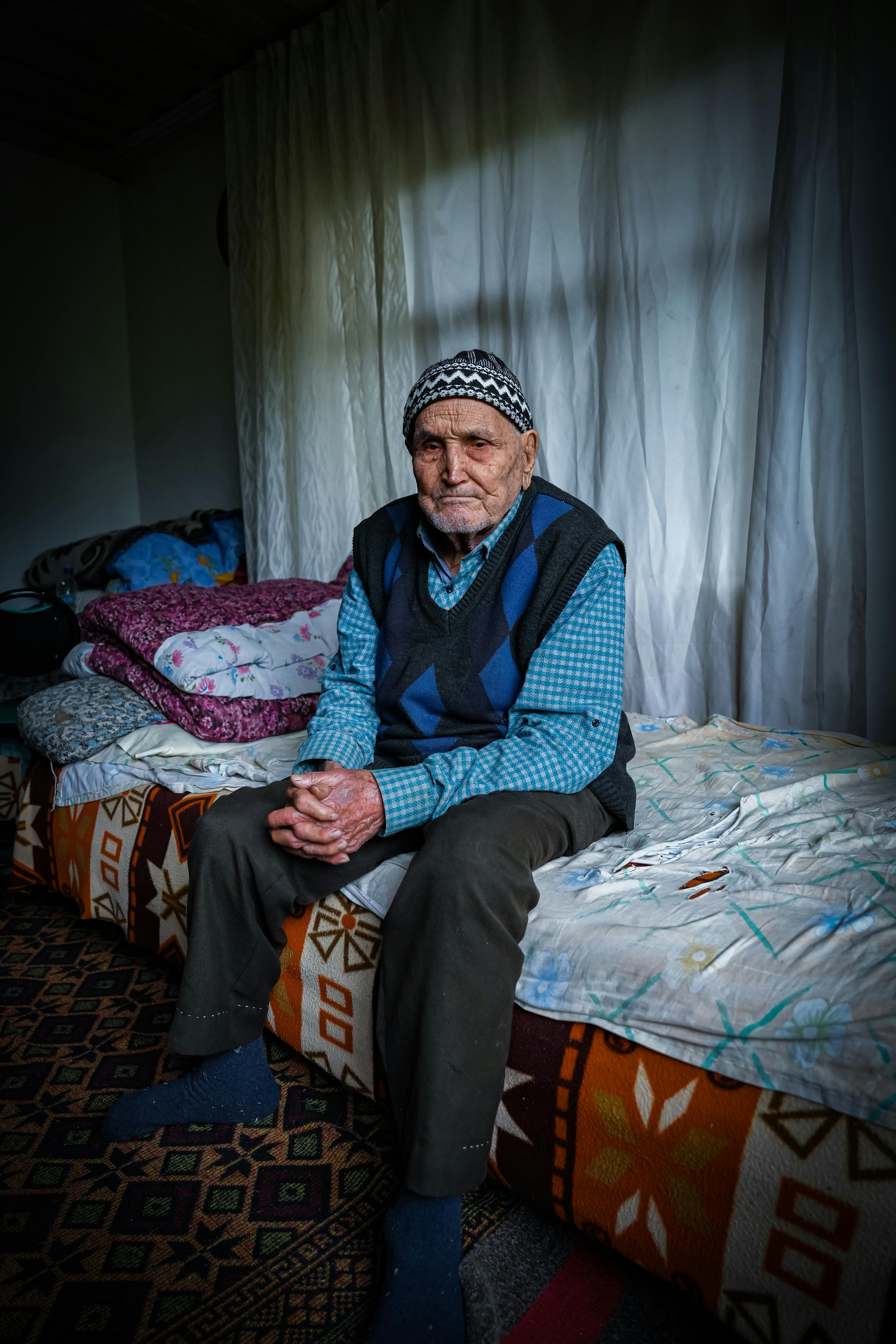 Old Man Sitting on the Bed · Free Stock Photo