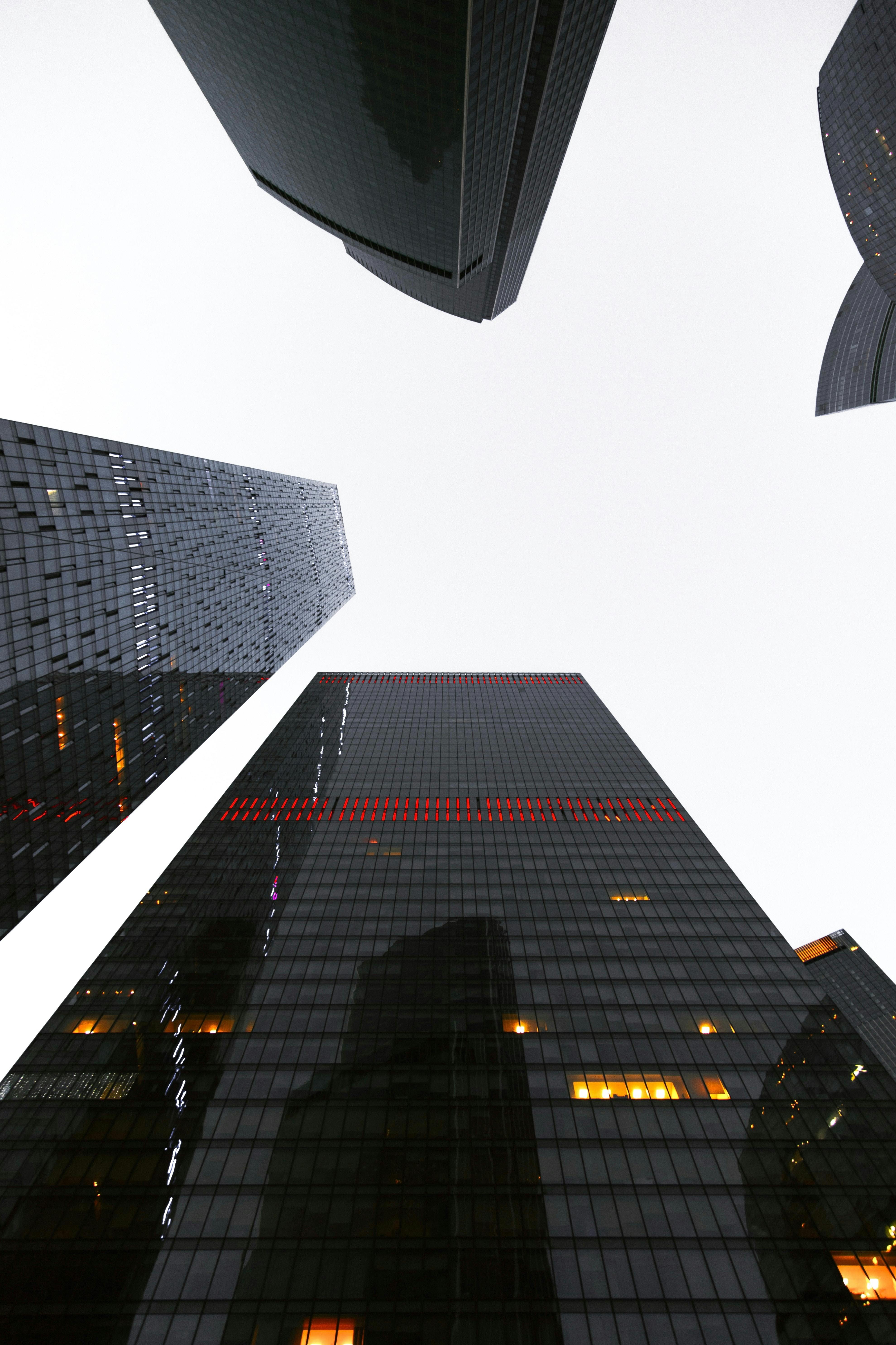 A view of tall buildings from the ground · Free Stock Photo