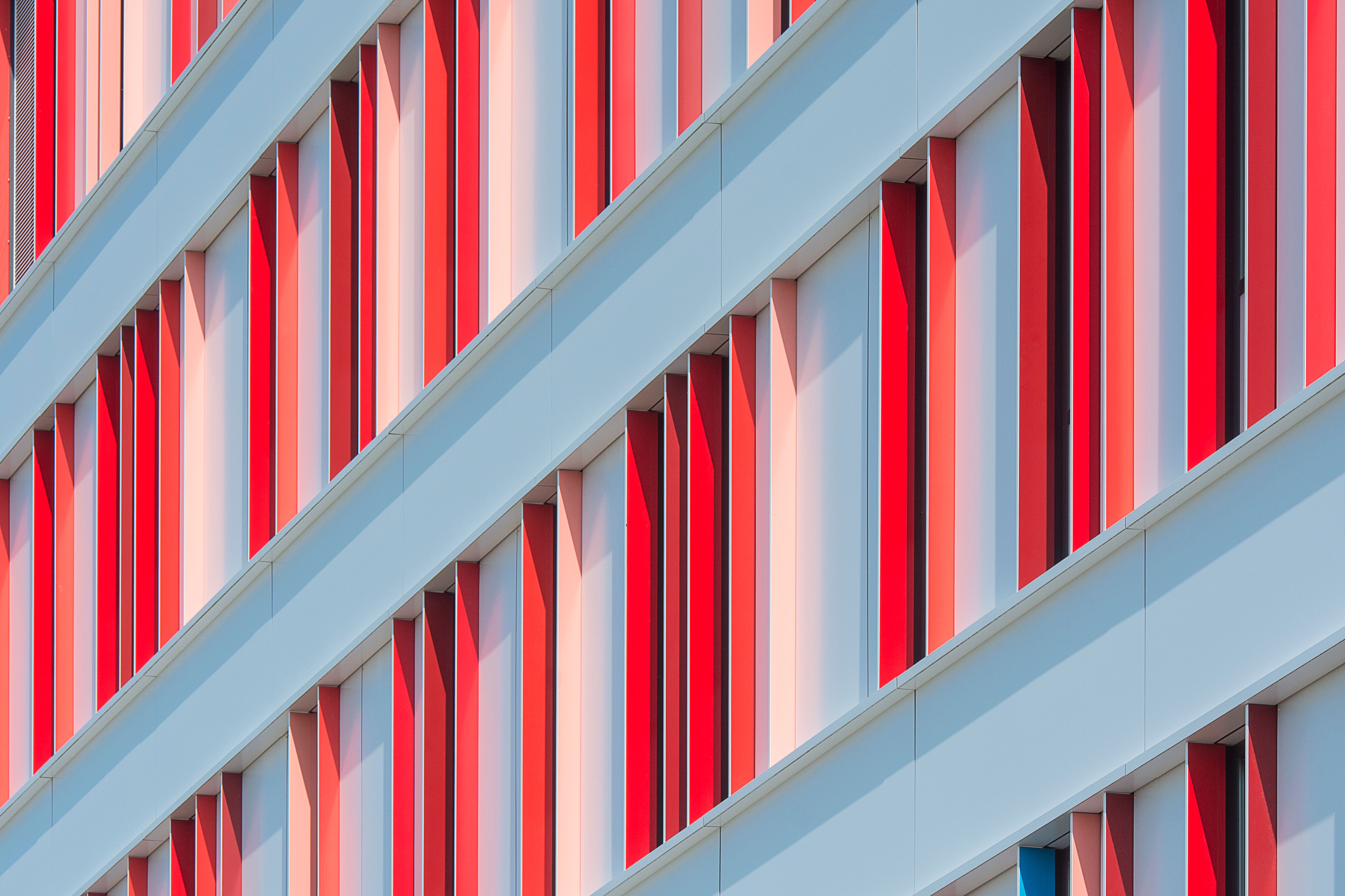 Red Stripes on Building Facade · Free Stock Photo