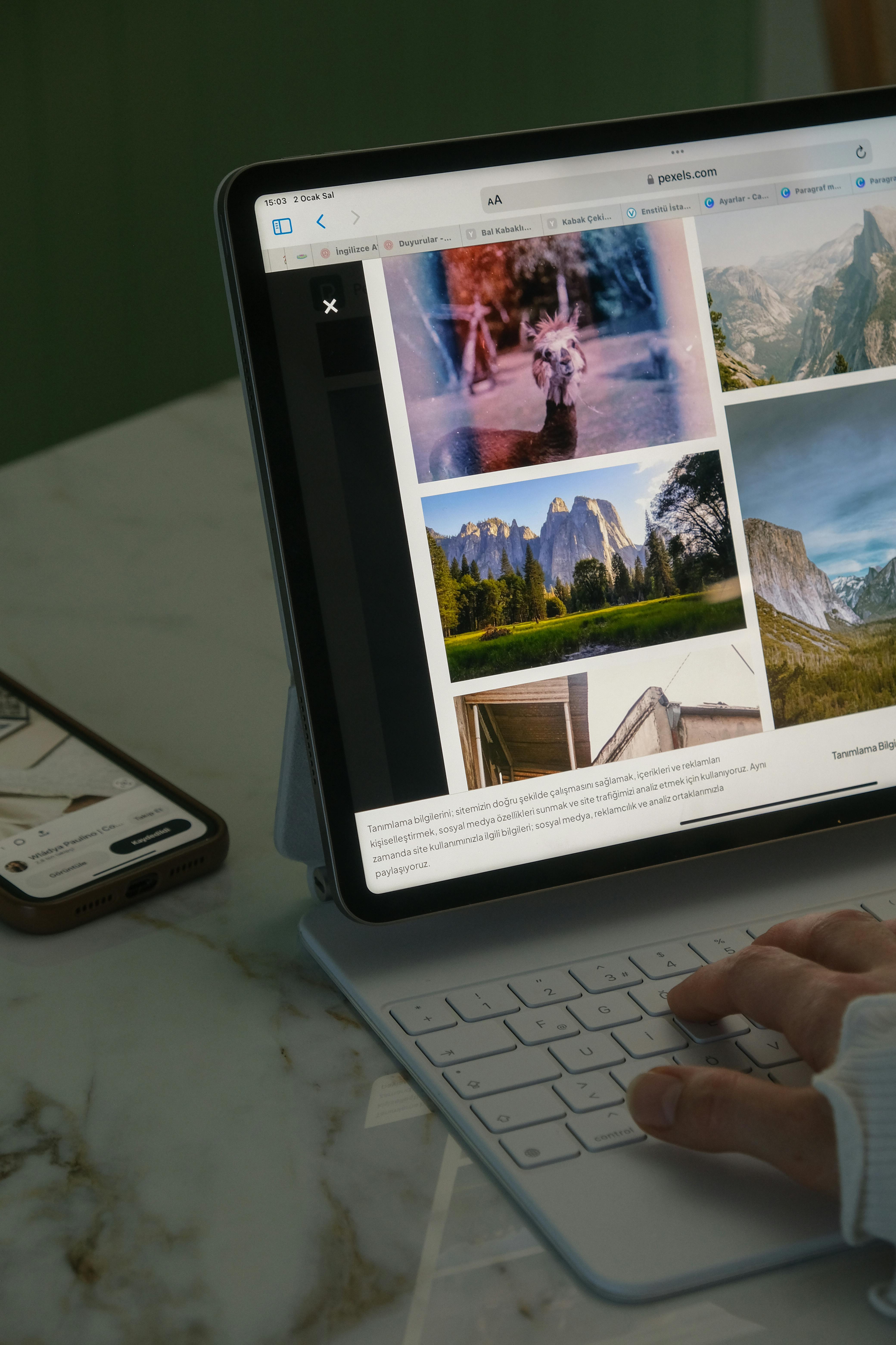 Person Using Tablet with Keyboard · Free Stock Photo