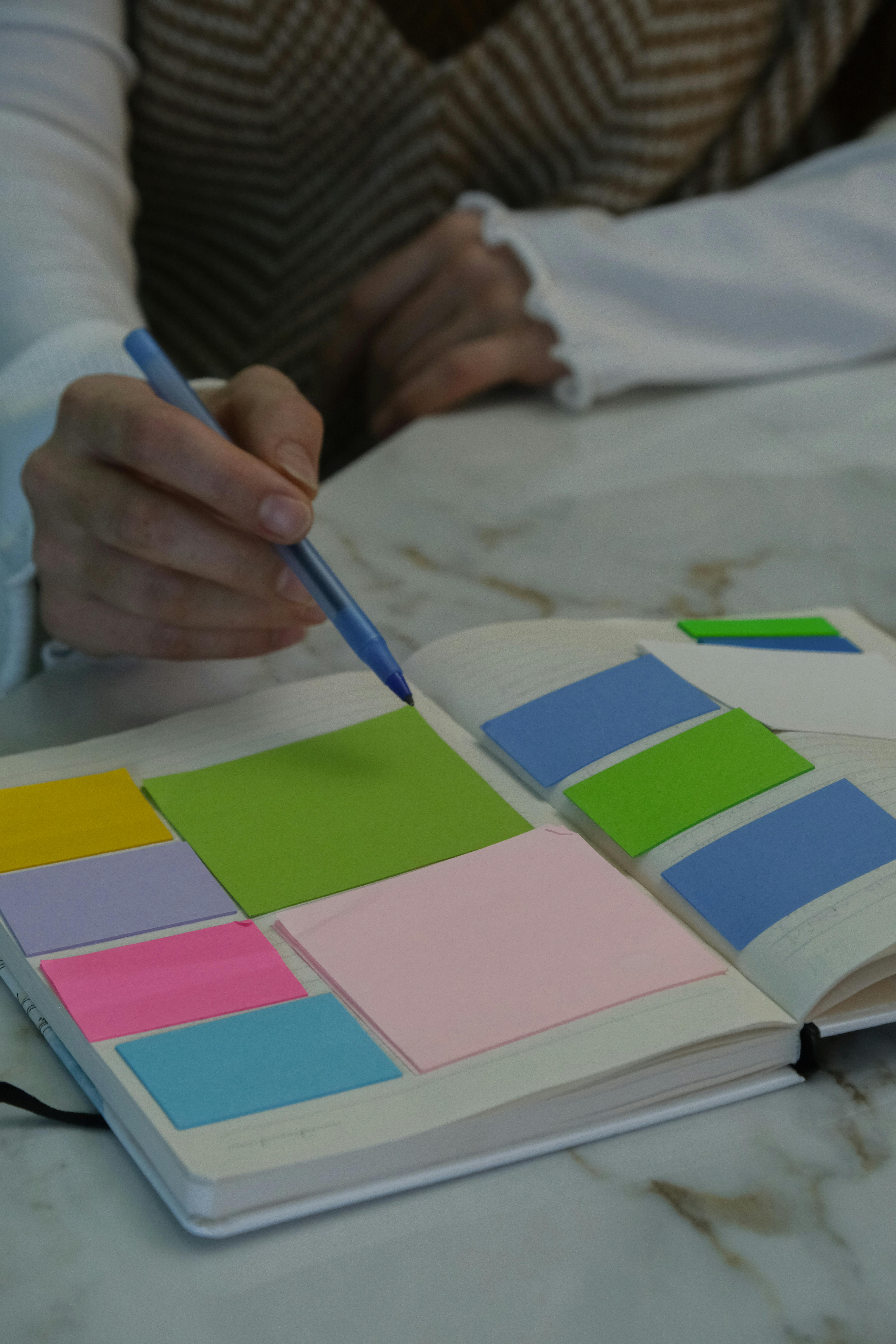 Colored Memo Stick in Notebook · Free Stock Photo