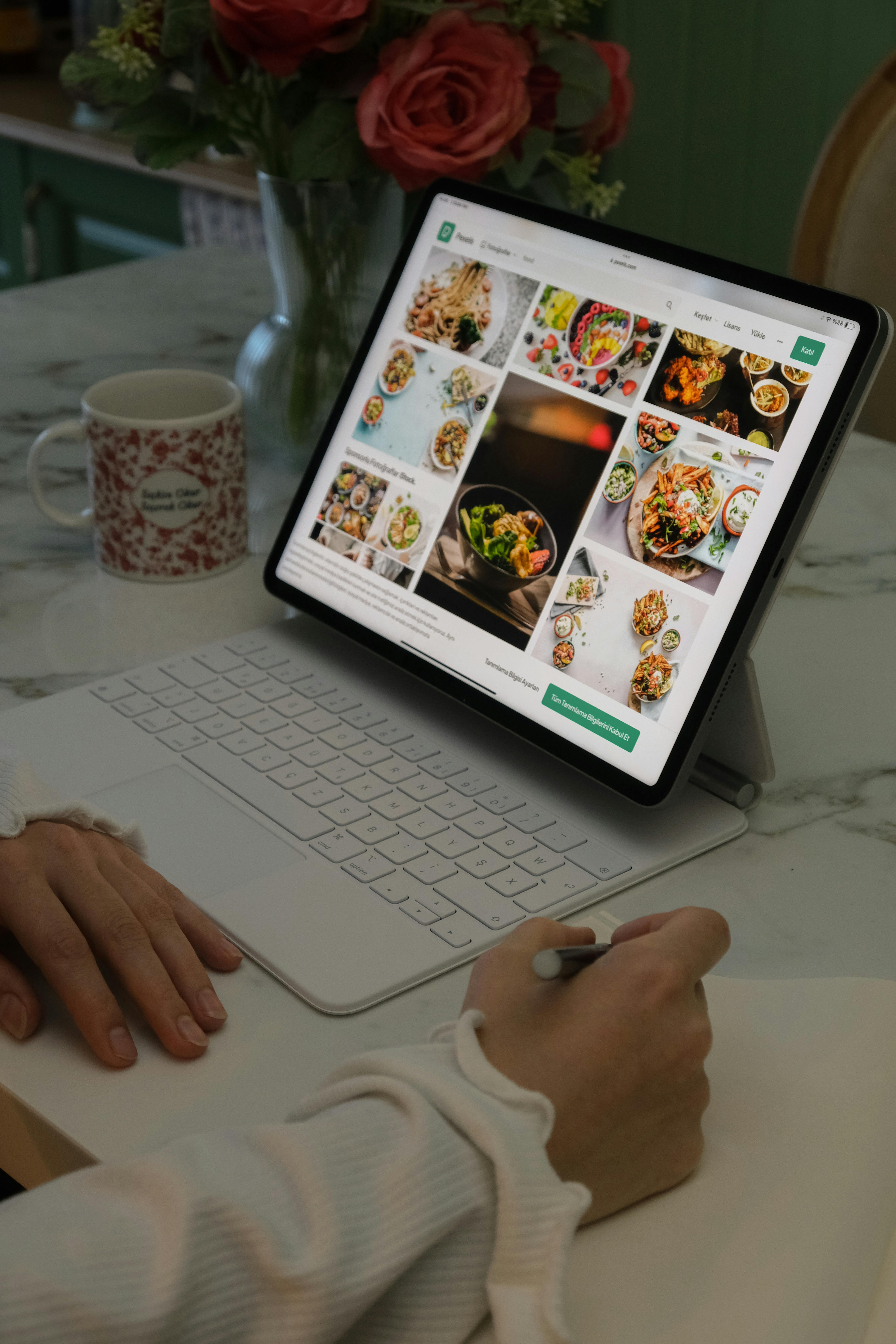 Person Using Tablet with Keyboard and Touchpad · Free Stock Photo