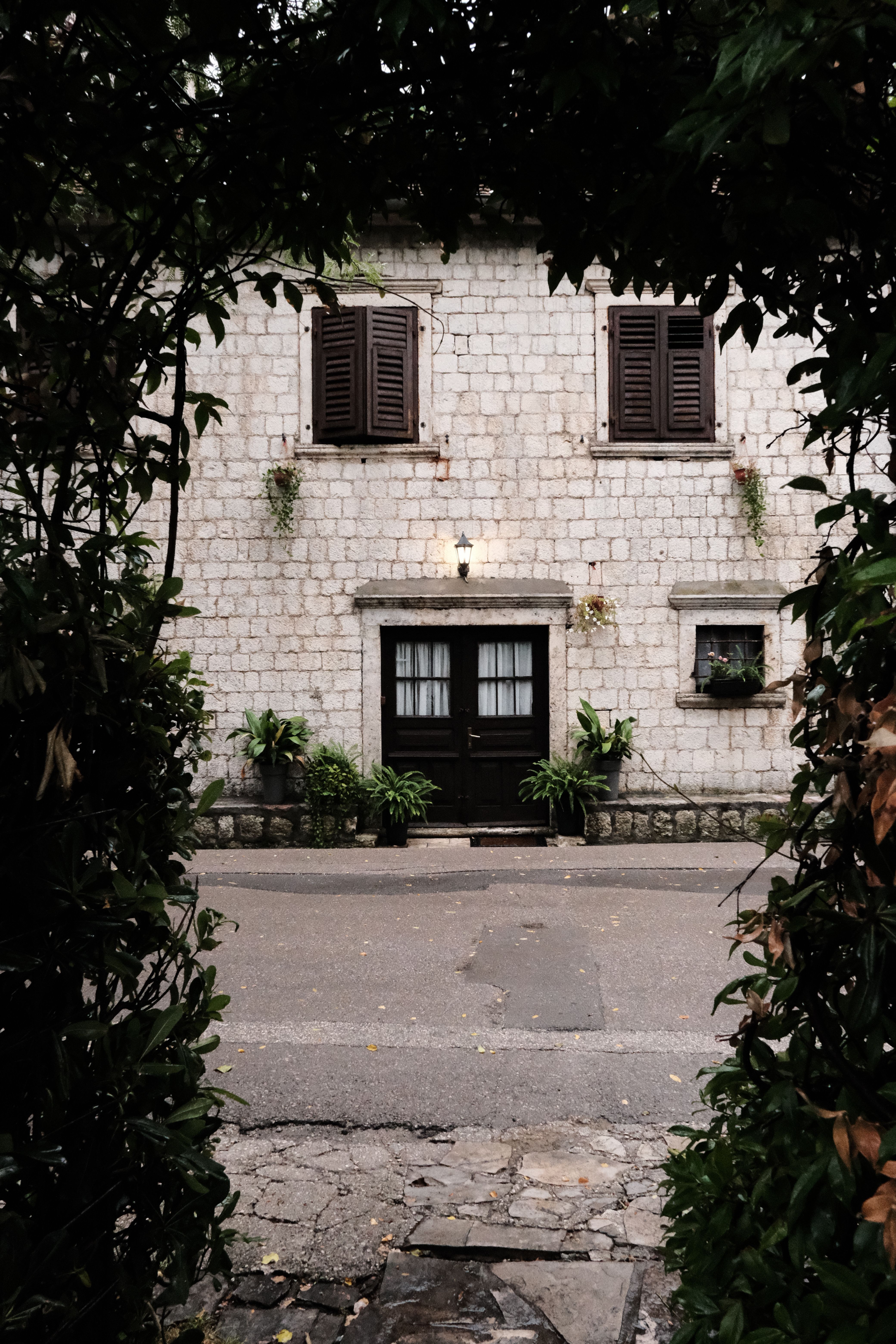 A house with a door and windows in the middle of the road · Free Stock ...