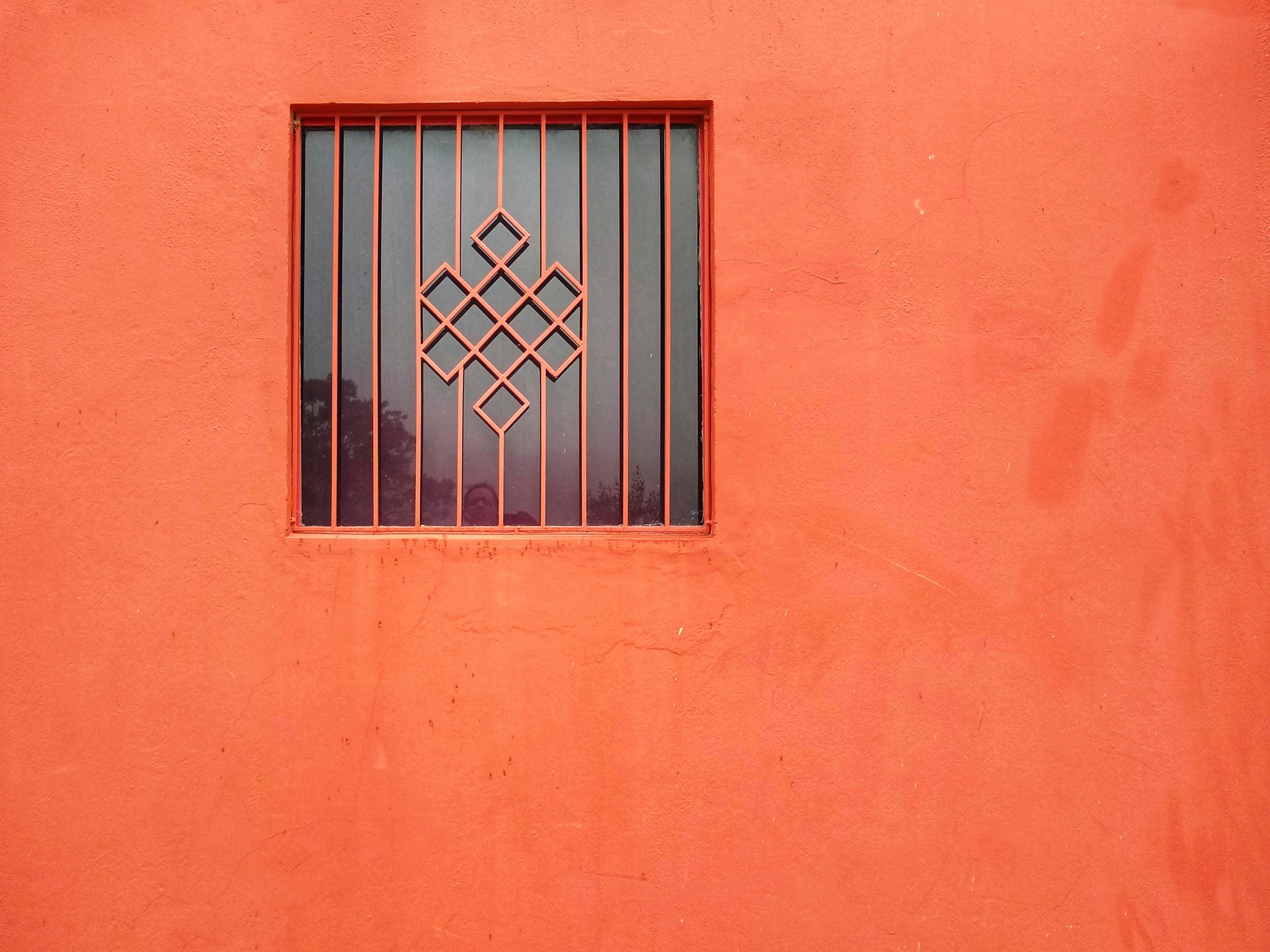 Bars on Window on Orange Wall · Free Stock Photo